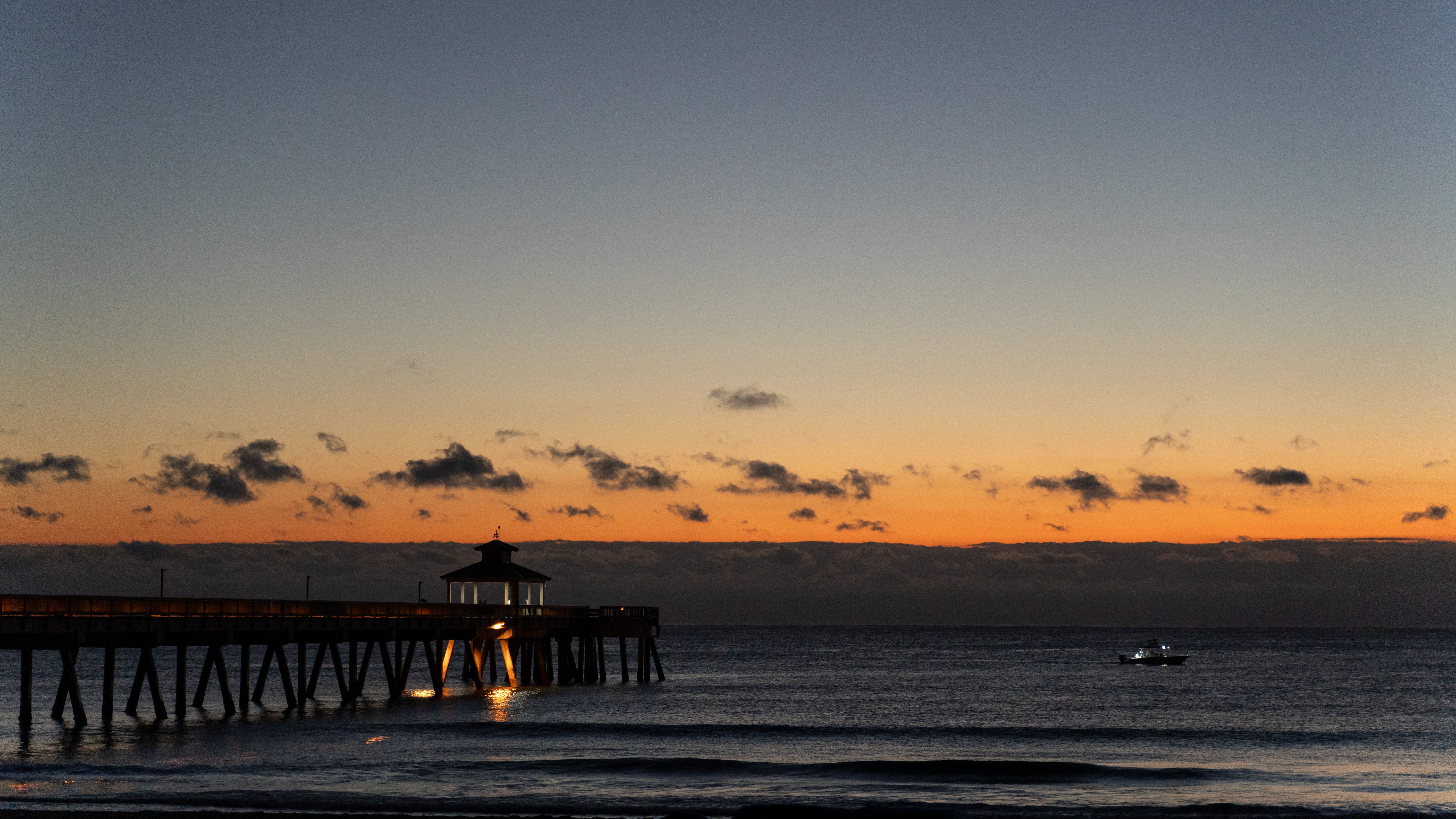 Peaceful Sunset Over Ocean Pier · Free Stock Photo