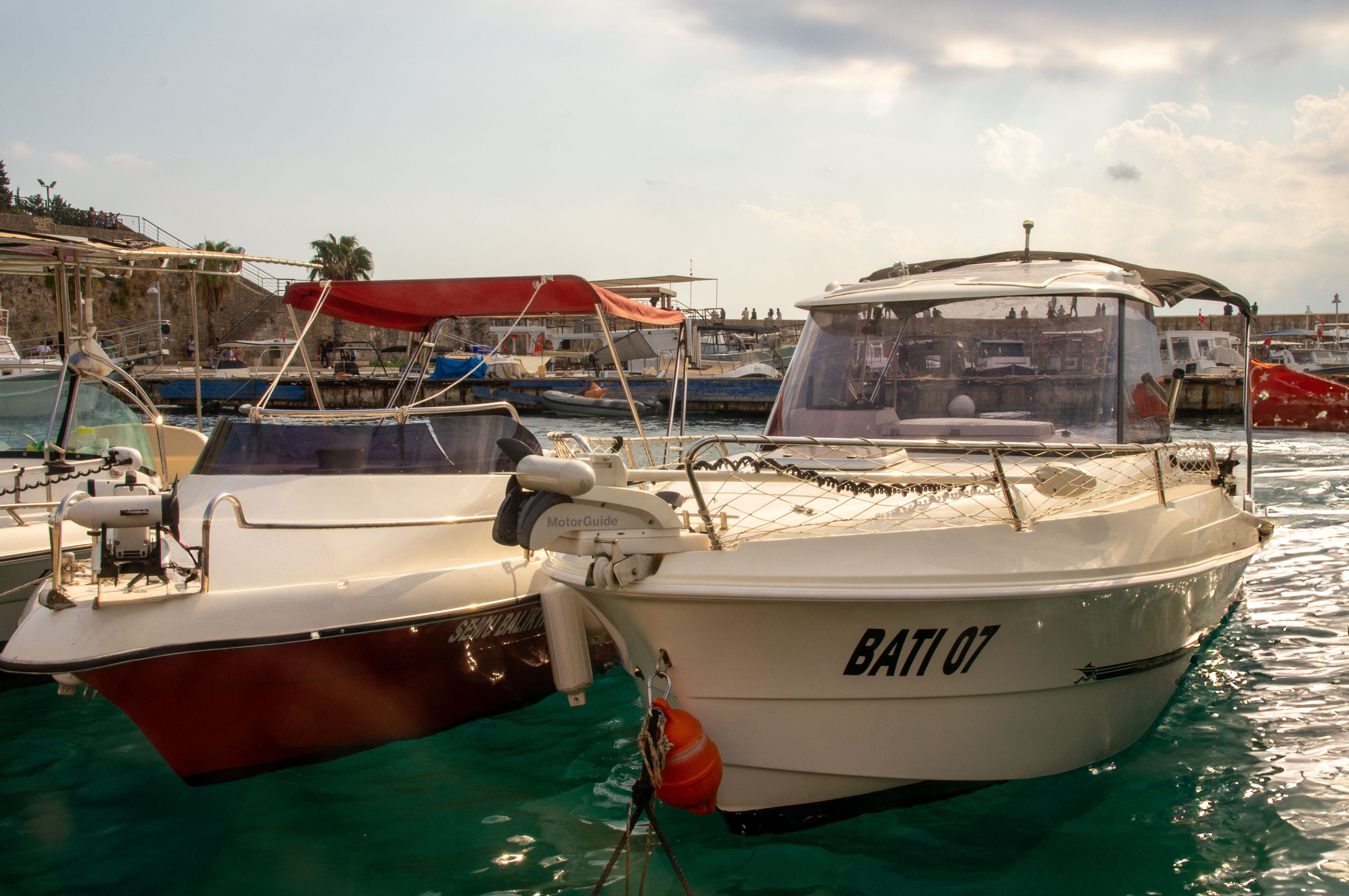 Scenic Harbour View with Moored Boats in Sunlight · Free Stock Photo