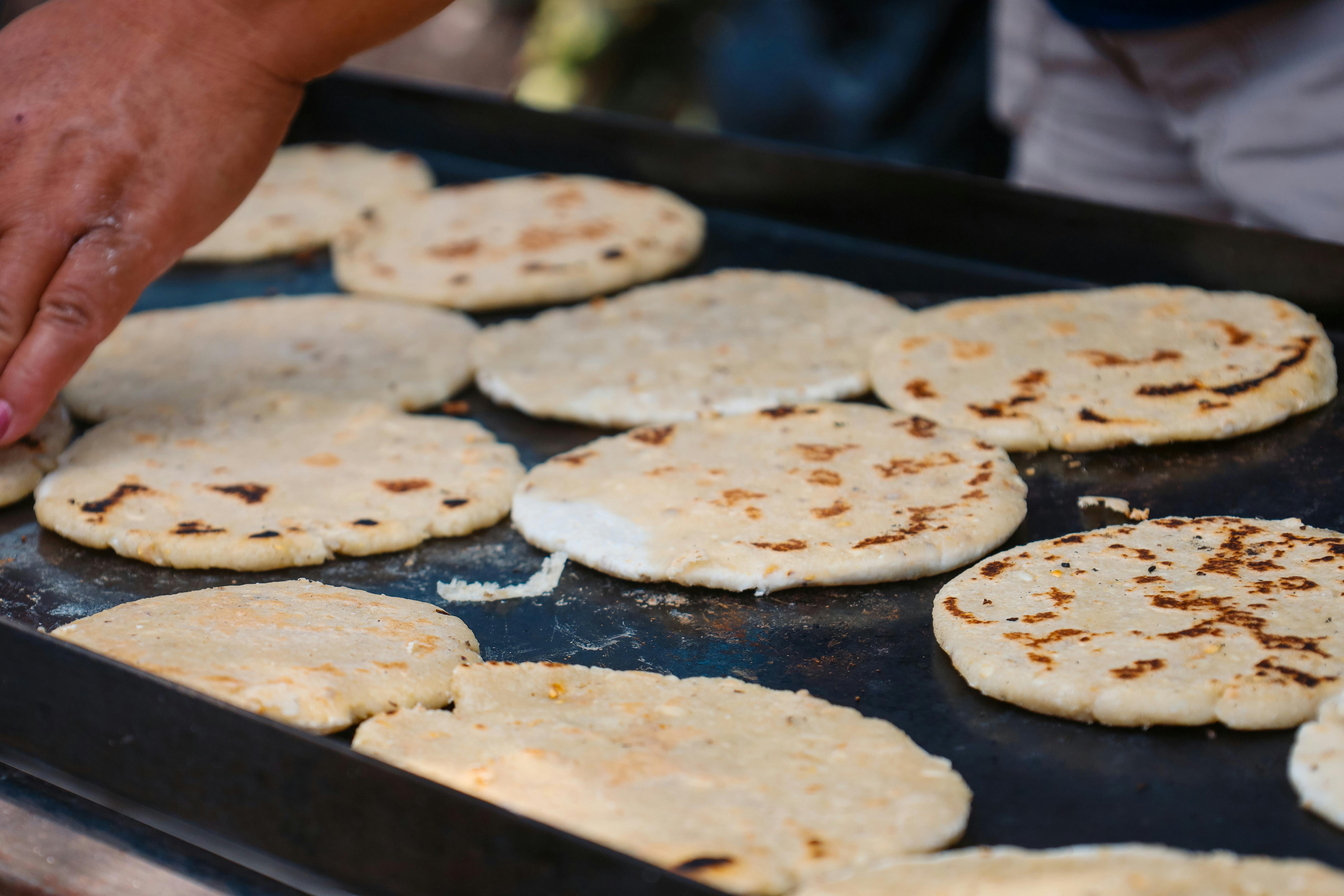 Homemade Arepas on Griddle Being Prepared · Free Stock Photo