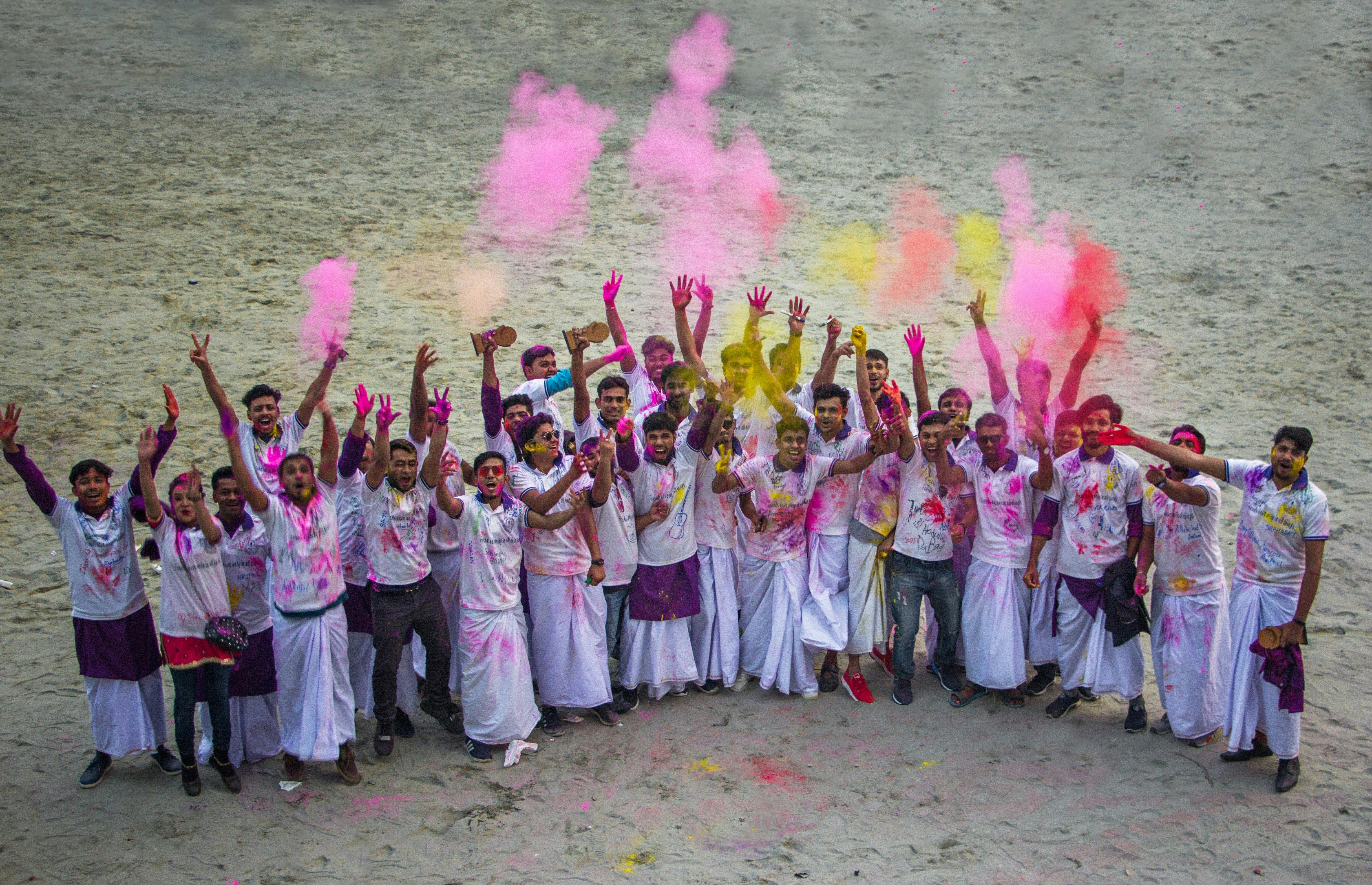 Festive Holi Celebration with Colorful Crowd · Free Stock Photo