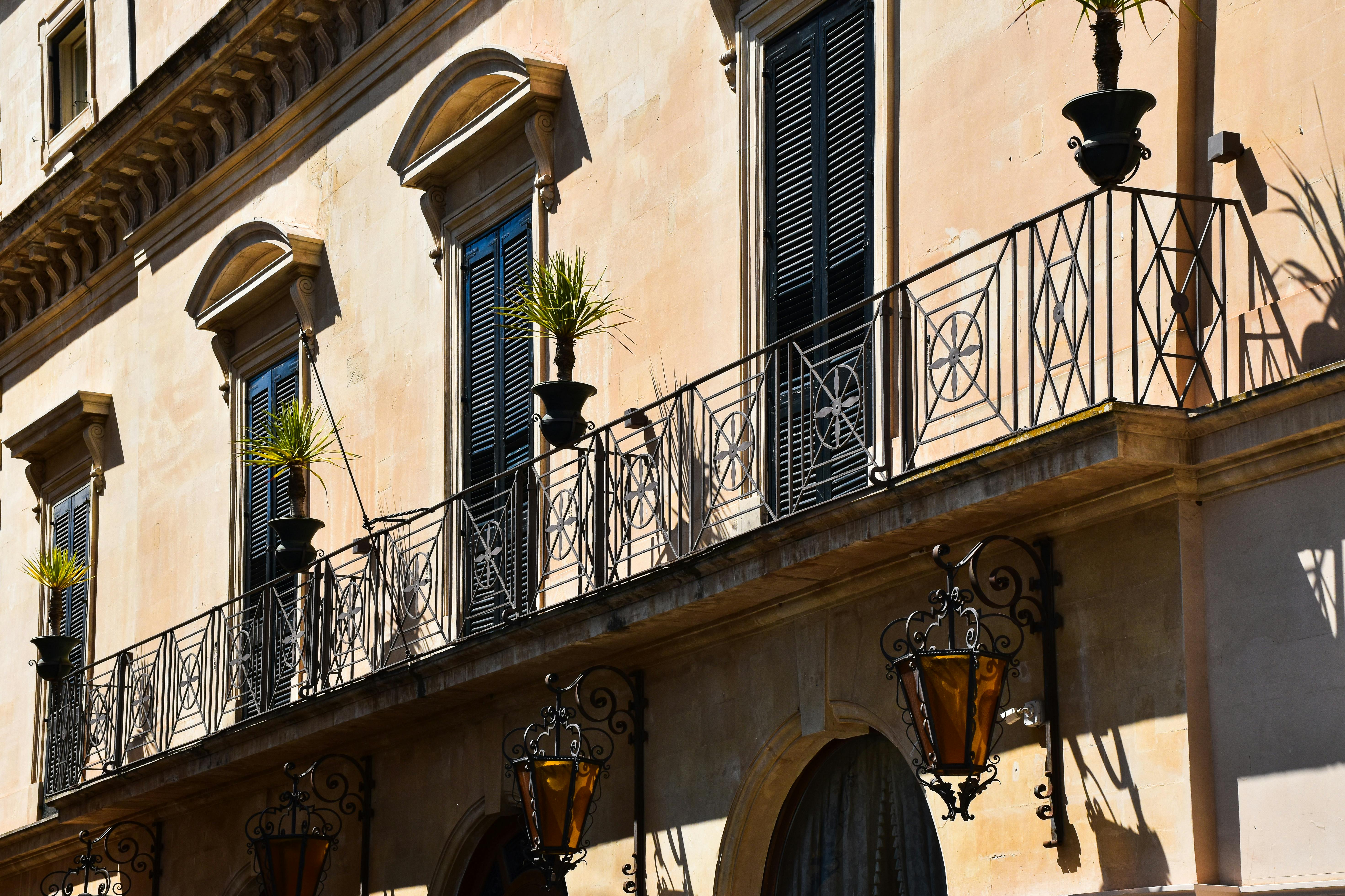 Classic Italian Balcony with Elegant Wrought Iron · Free Stock Photo