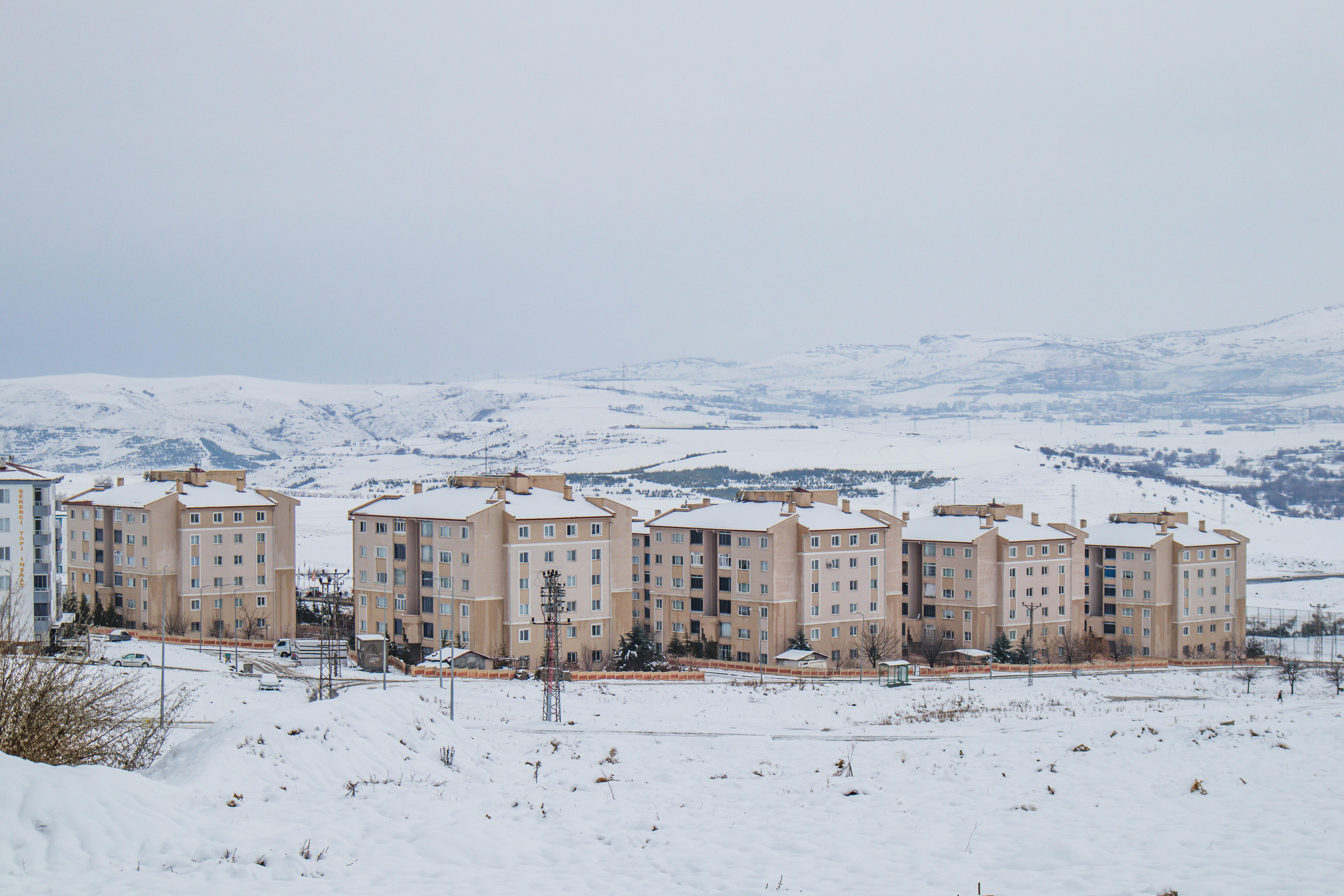 Snow-covered Apartment Buildings in Palu, Türkiye · Free Stock Photo