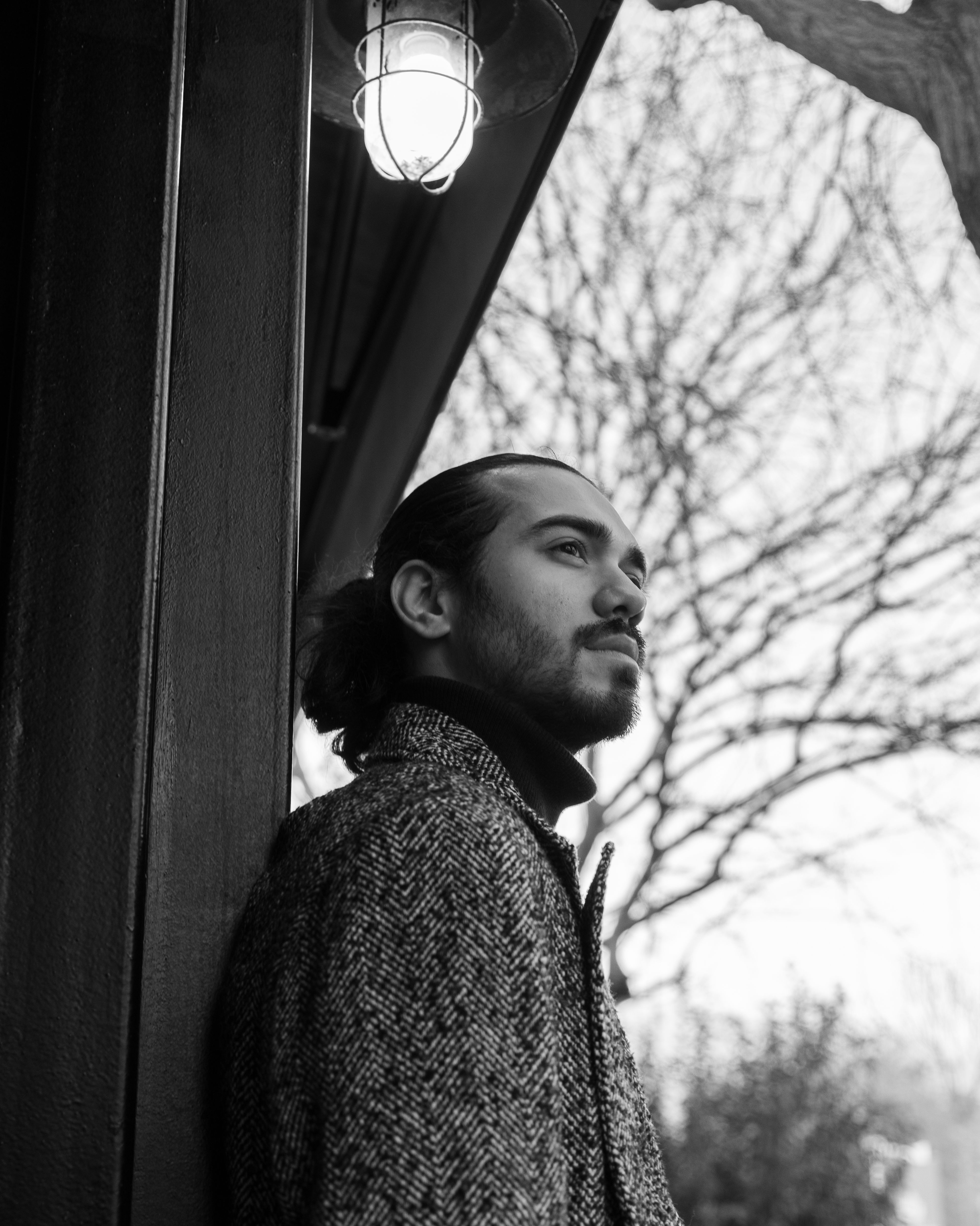 Pensive man leaning outdoor against wall · Free Stock Photo