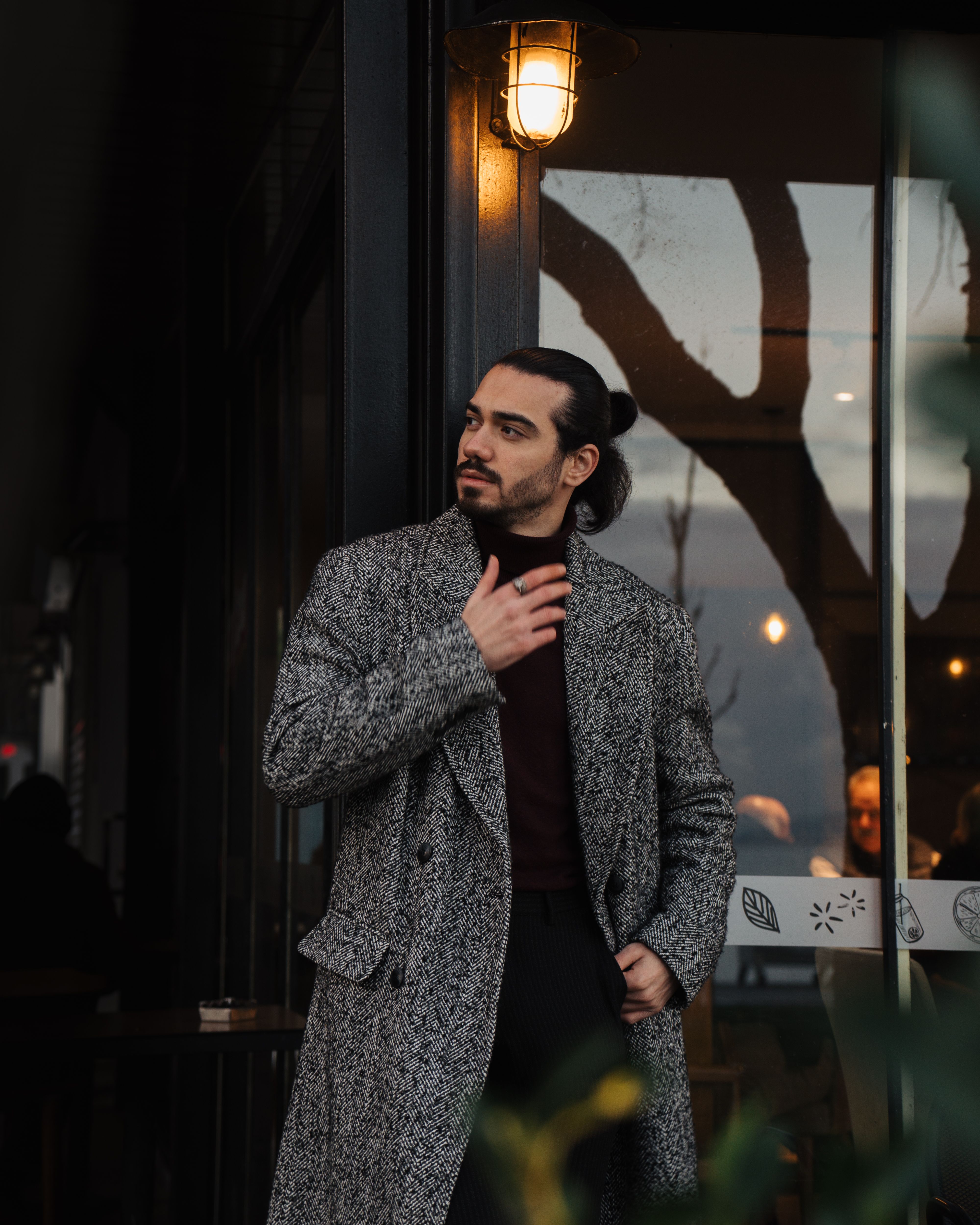 Stylish Man Standing Outside Cafe at Twilight · Free Stock Photo