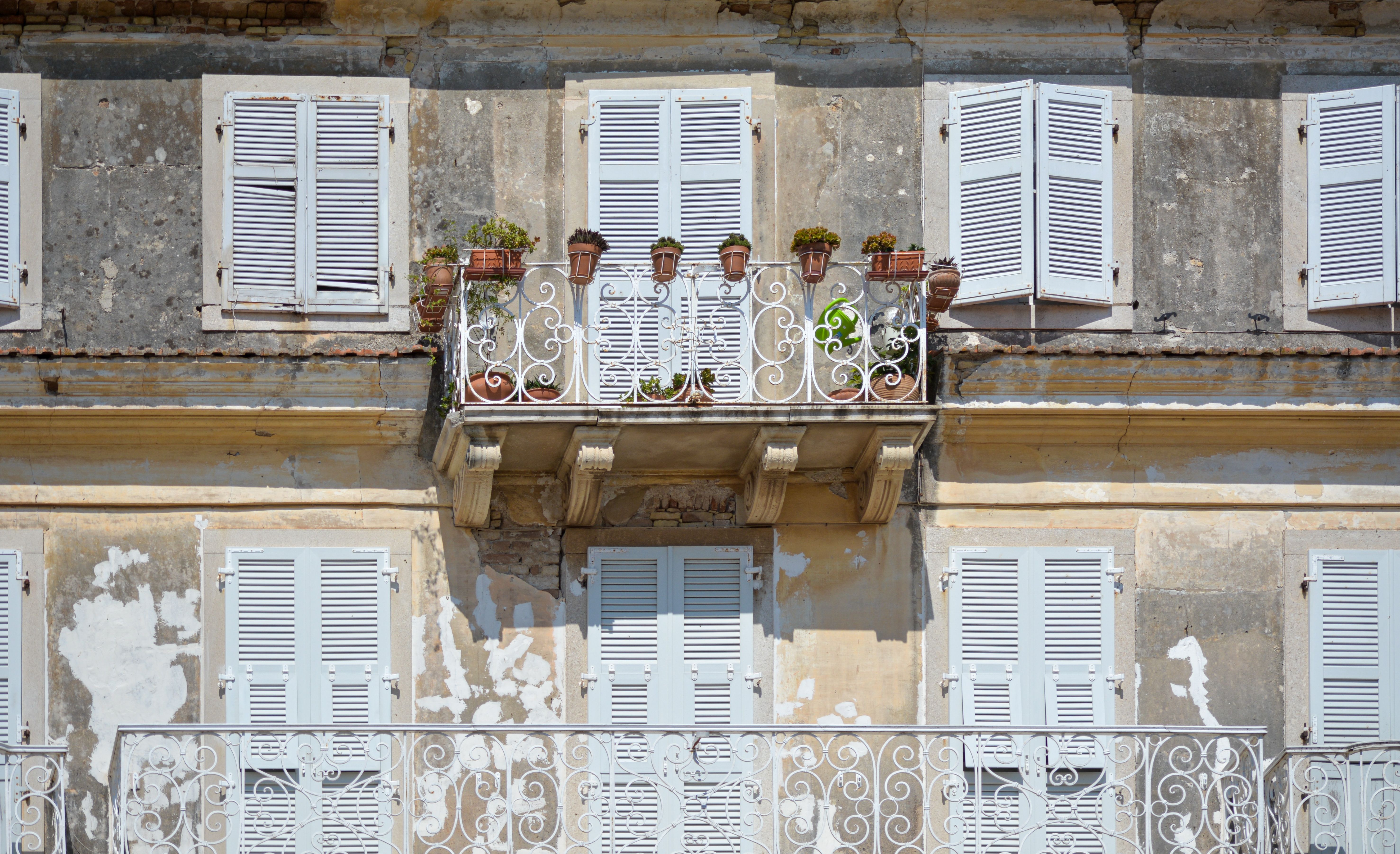 Charming Old Town Balcony with Potted Plants · Free Stock Photo