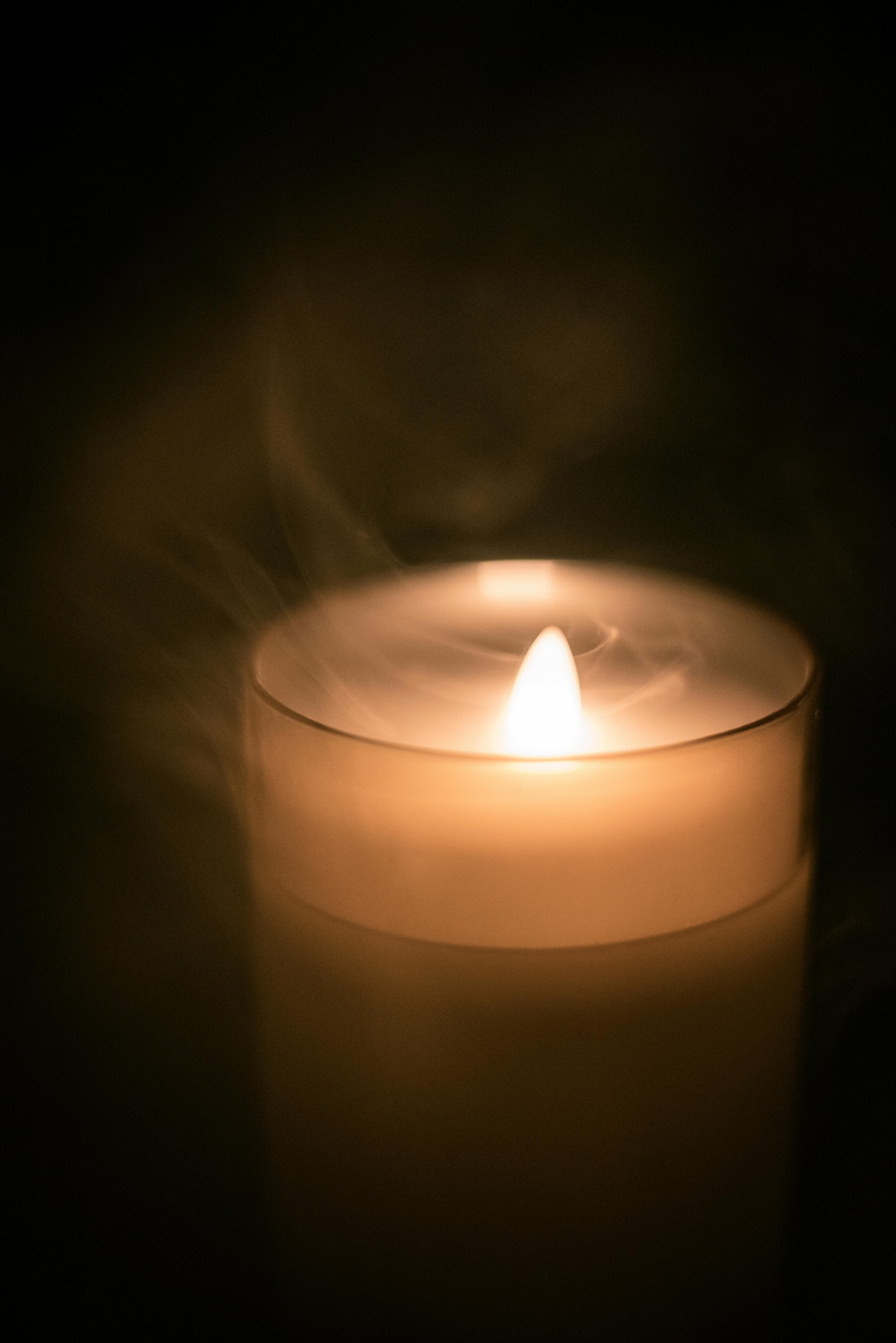 Warm Candlelight and Rising Smoke Still Life · Free Stock Photo