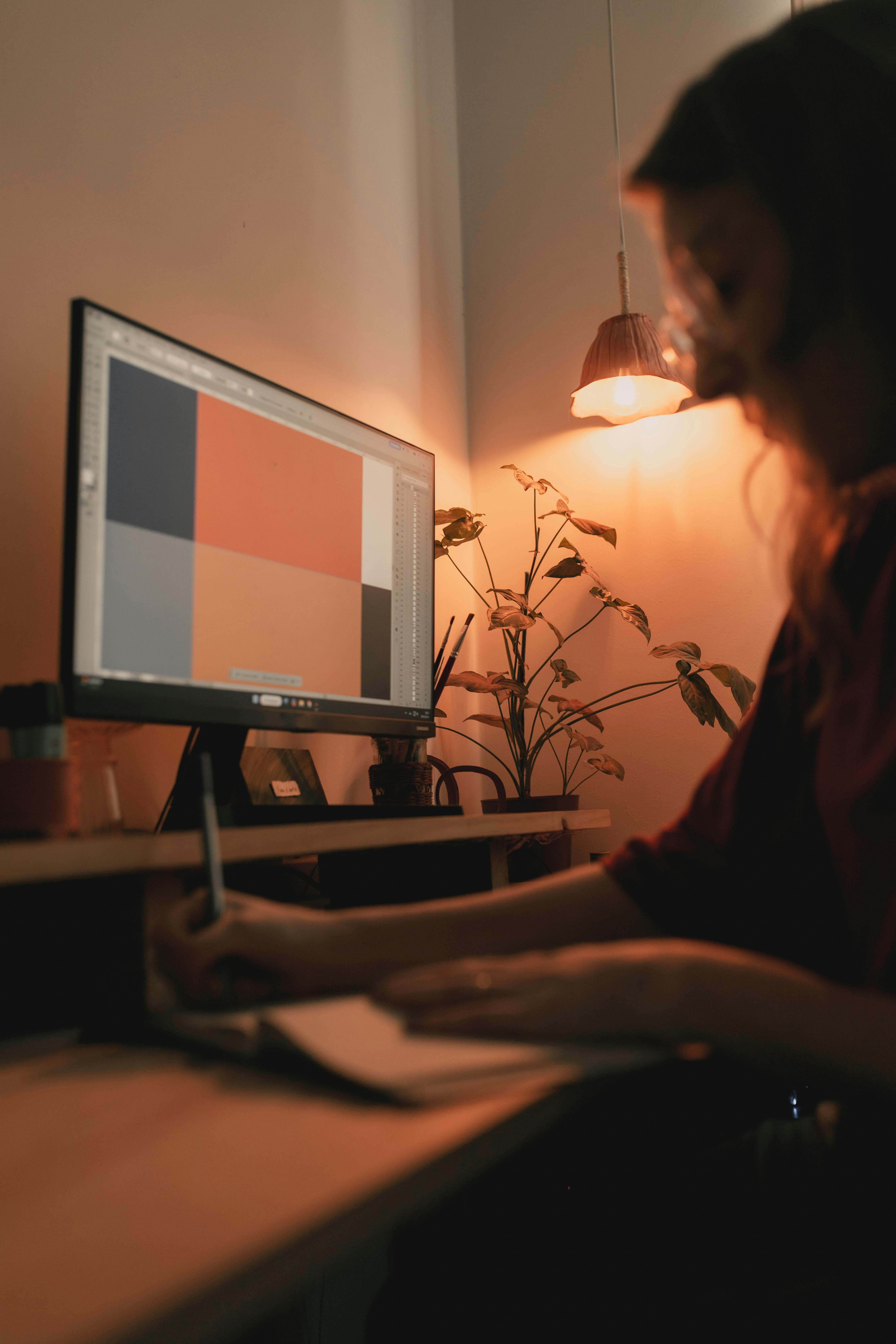 Creative workspace with designer at desk · Free Stock Photo