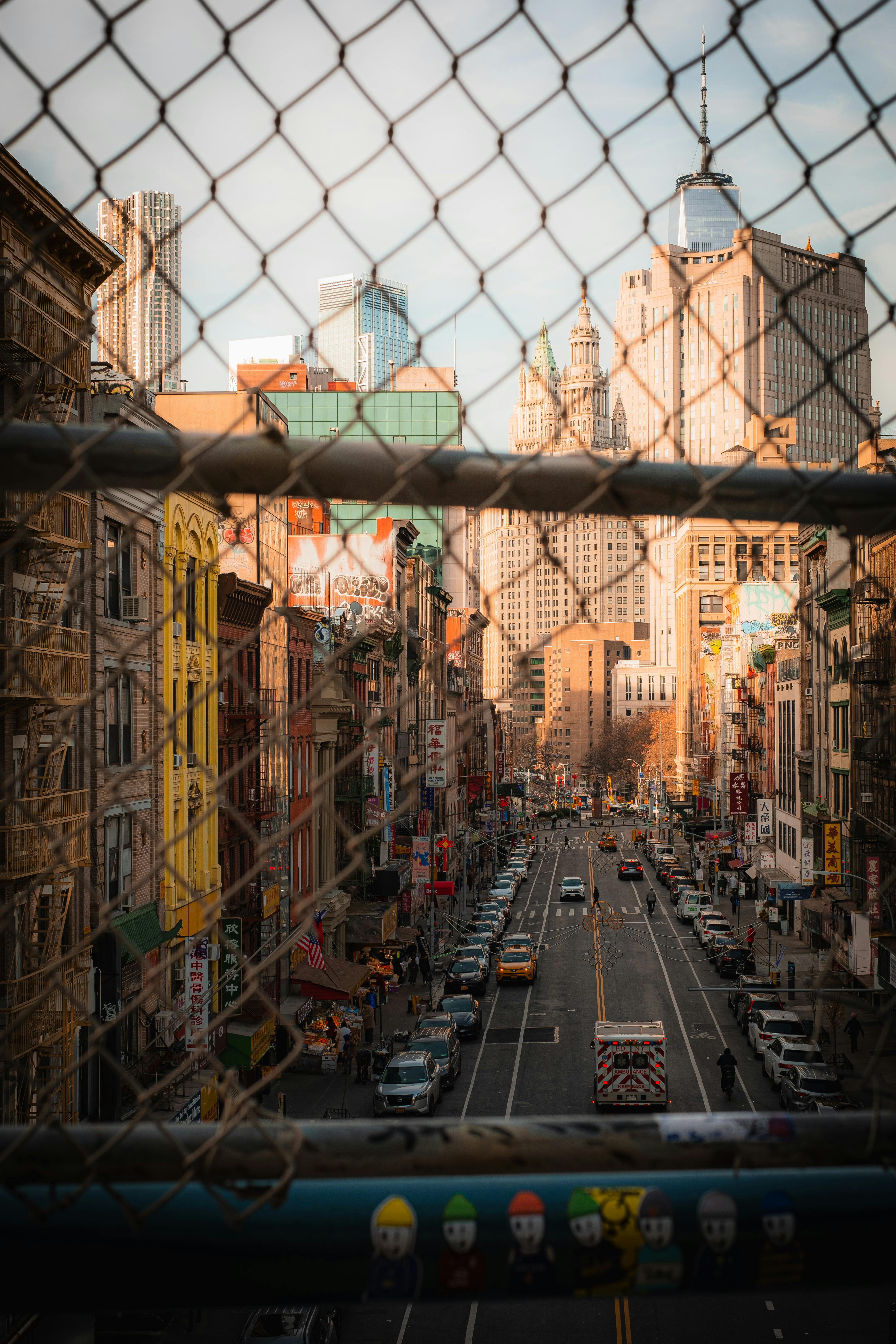 Urban Cityscape View Through Chain-Link Fence · Free Stock Photo