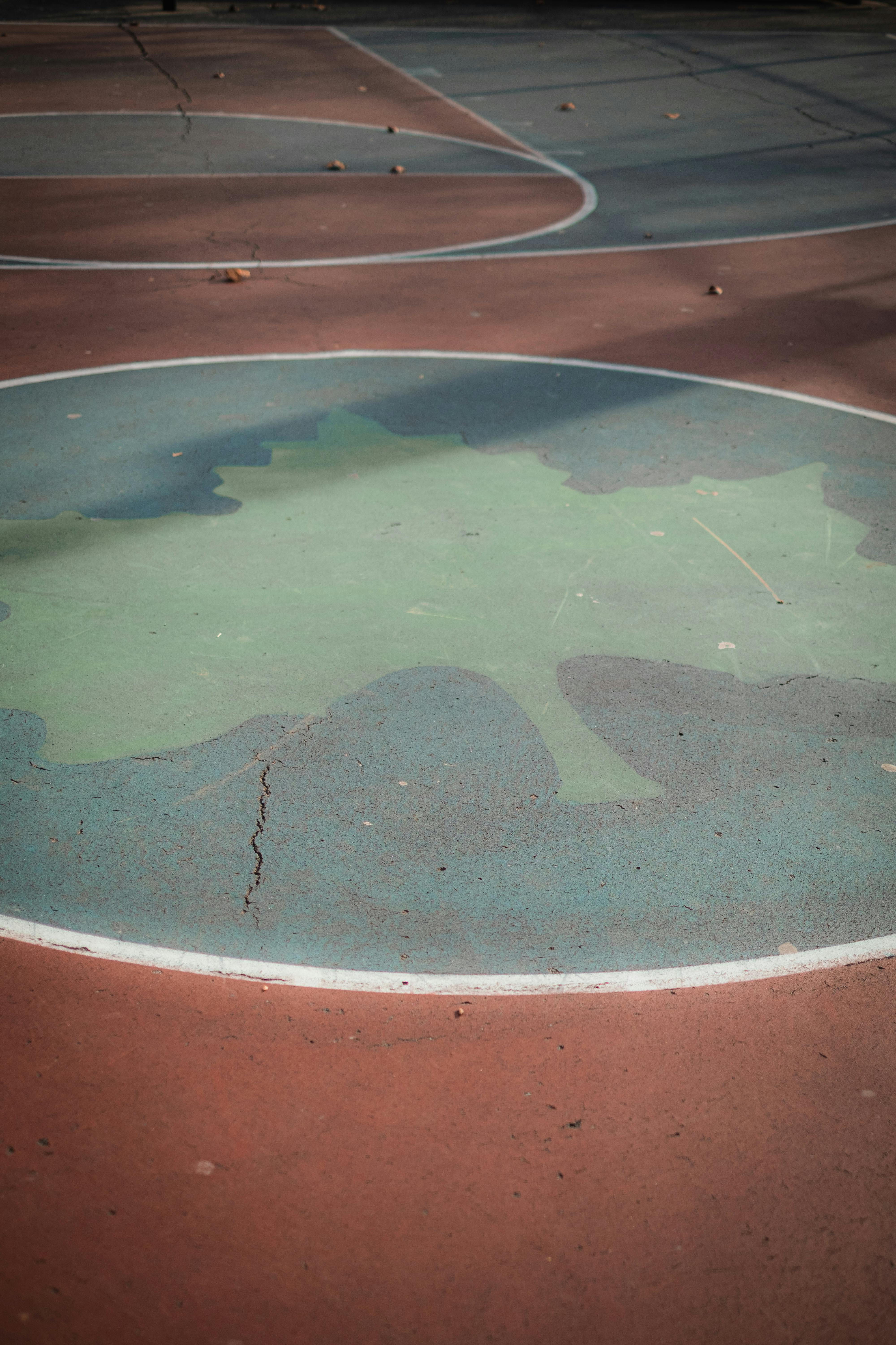 Outdoor Basketball Court with Leaf Design · Free Stock Photo