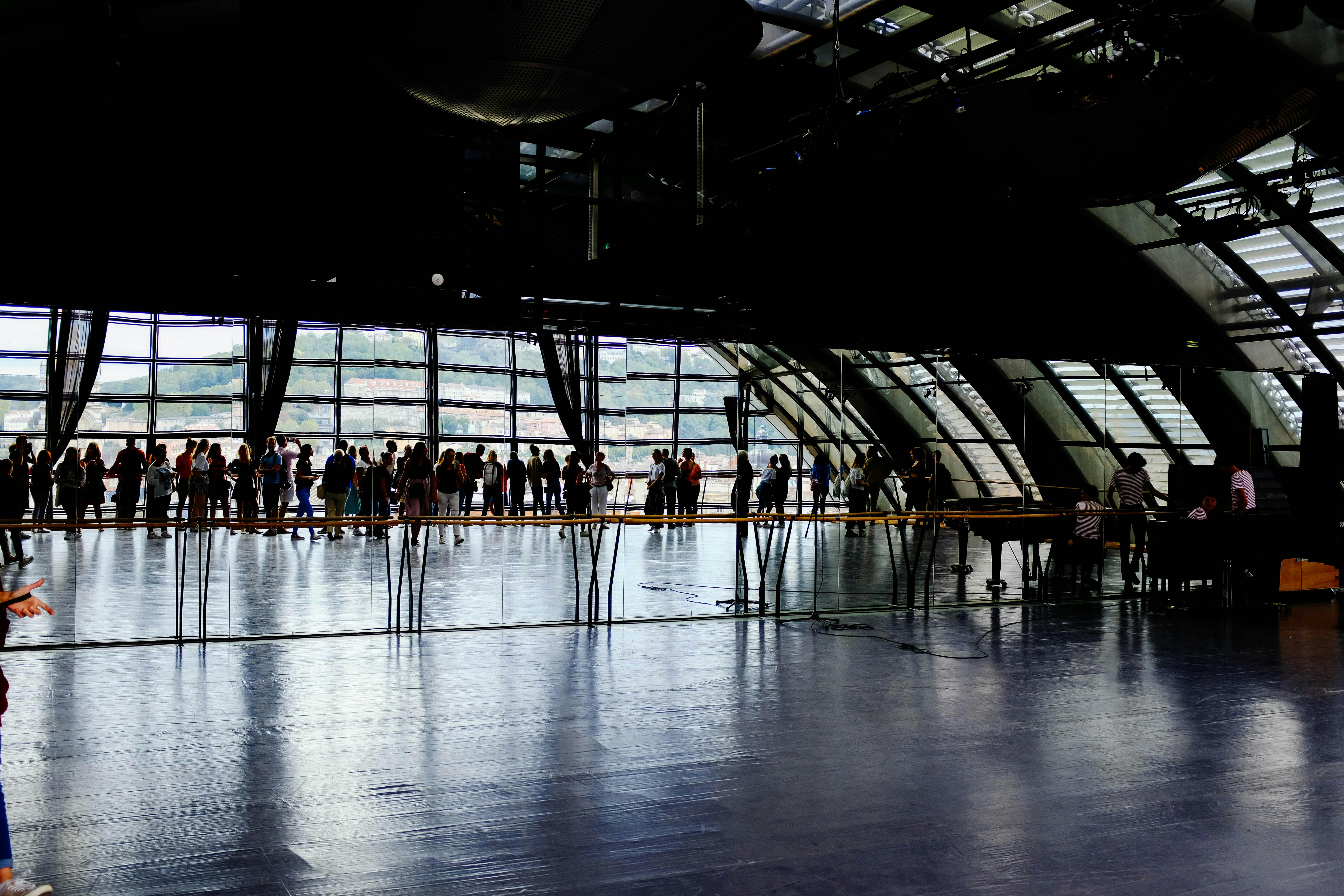 Group of People Near Clear Glass Window · Free Stock Photo