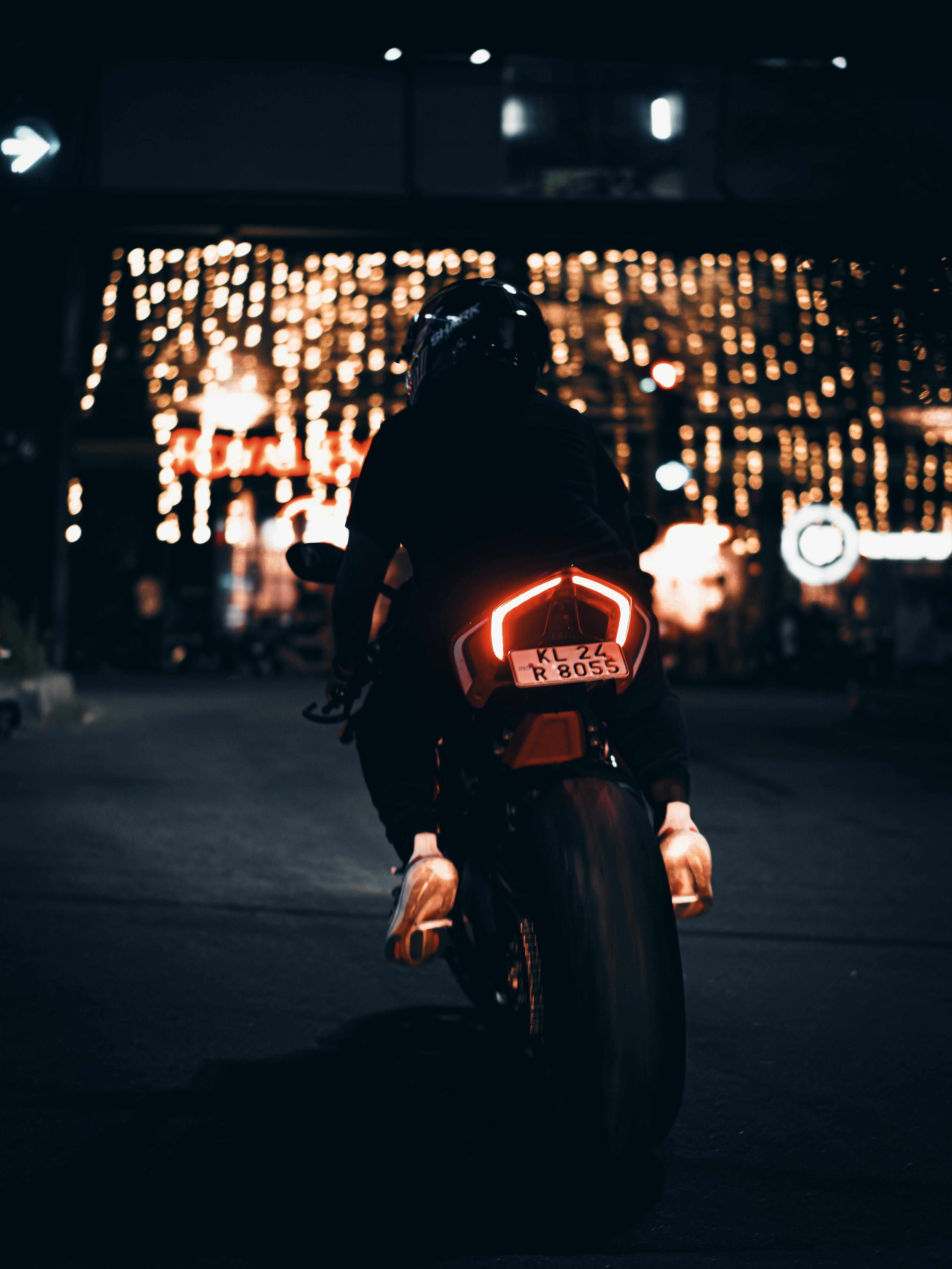 Night Ride on a Motorcycle Under City Lights · Free Stock Photo