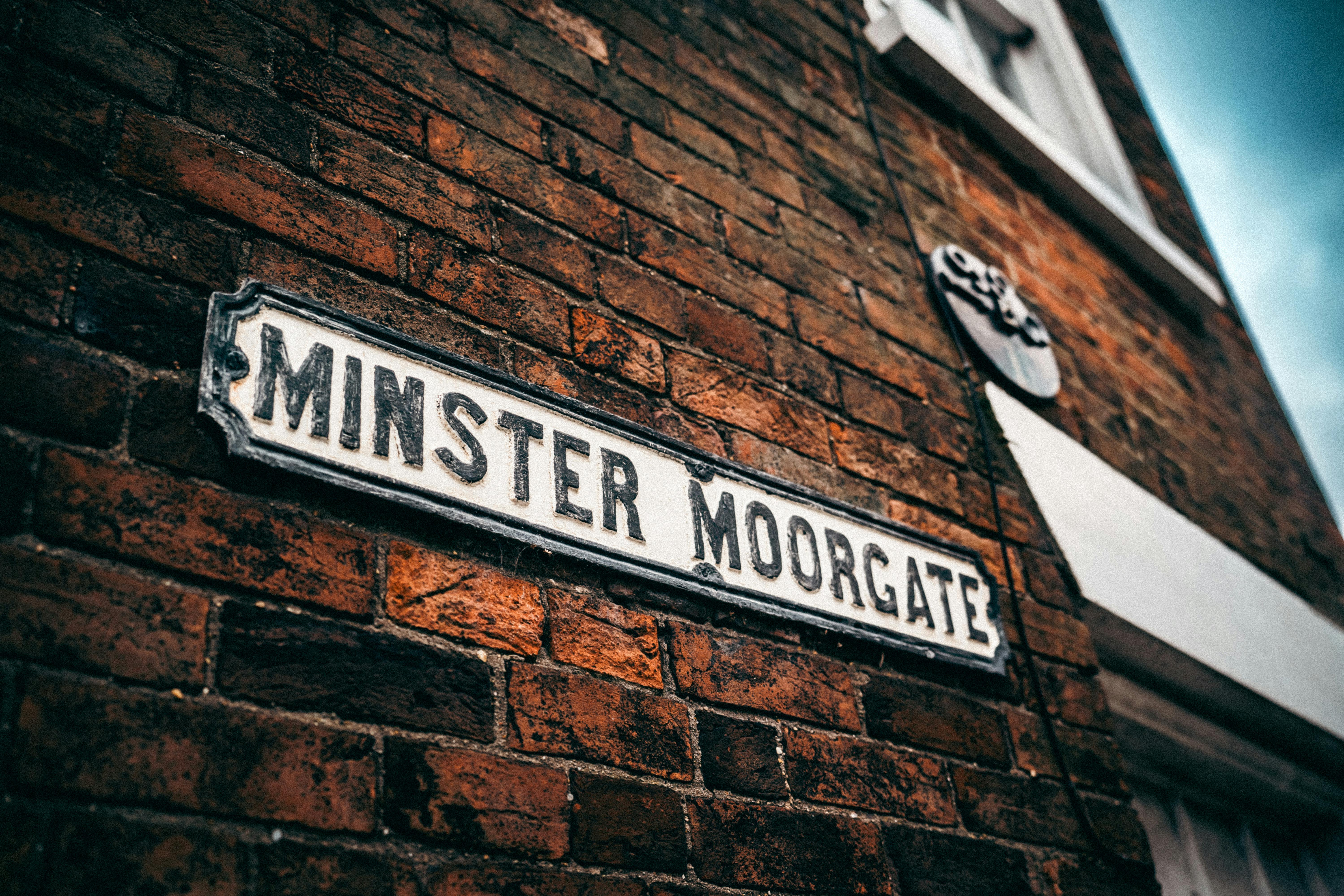 Vintage Brick Wall with Street Sign · Free Stock Photo