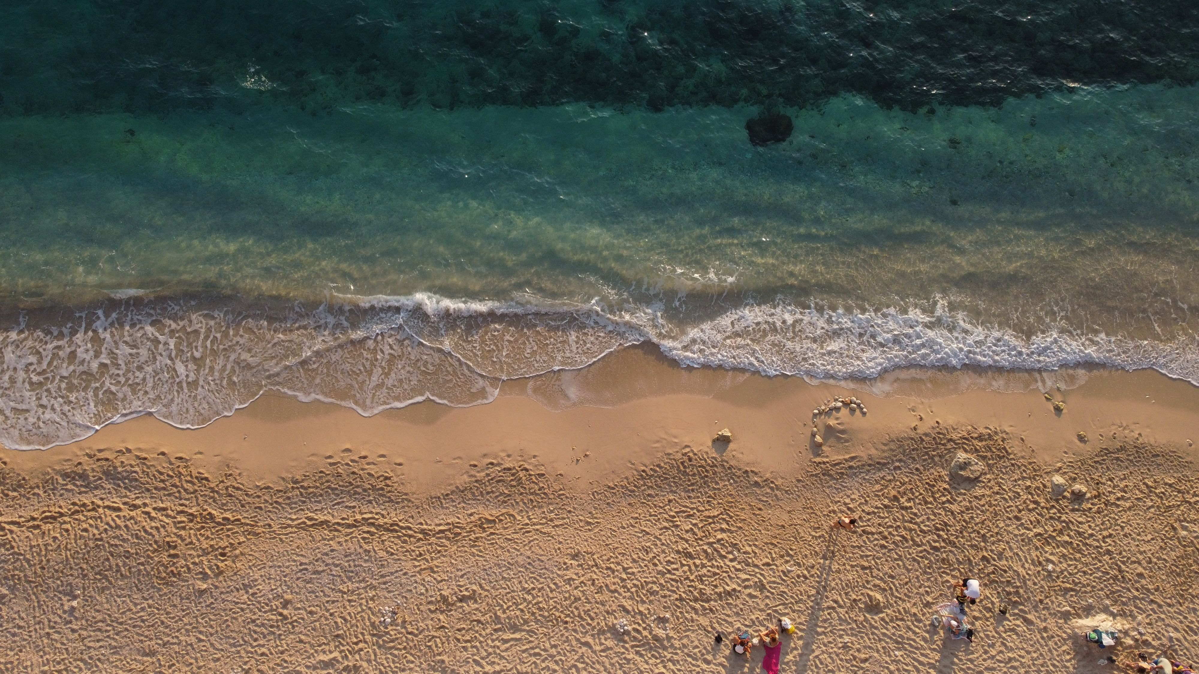 Aerial View of Sandy Beach and Ocean Waves · Free Stock Photo
