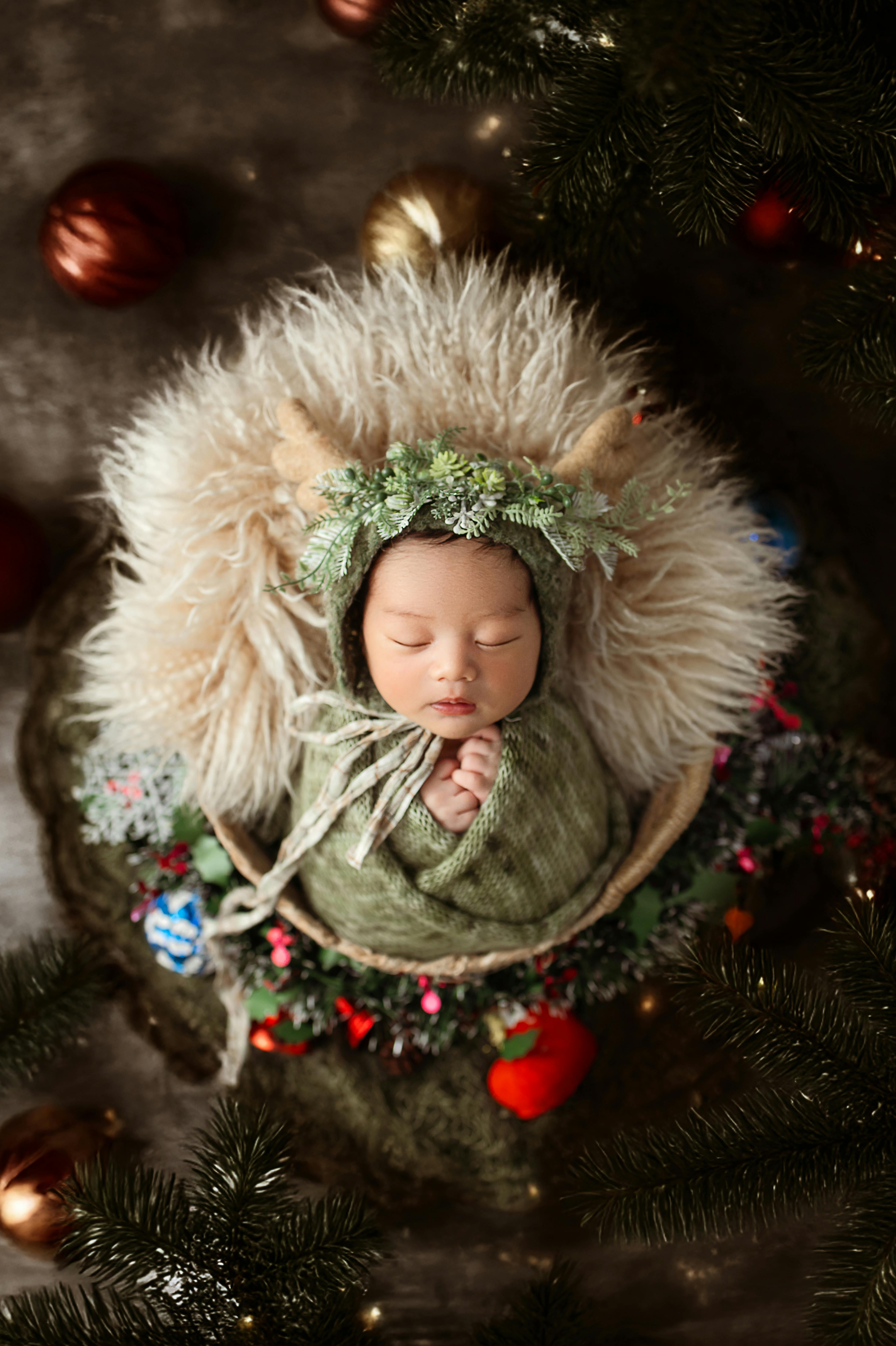 Cozy Baby Sleeping in Holiday Nest · Free Stock Photo