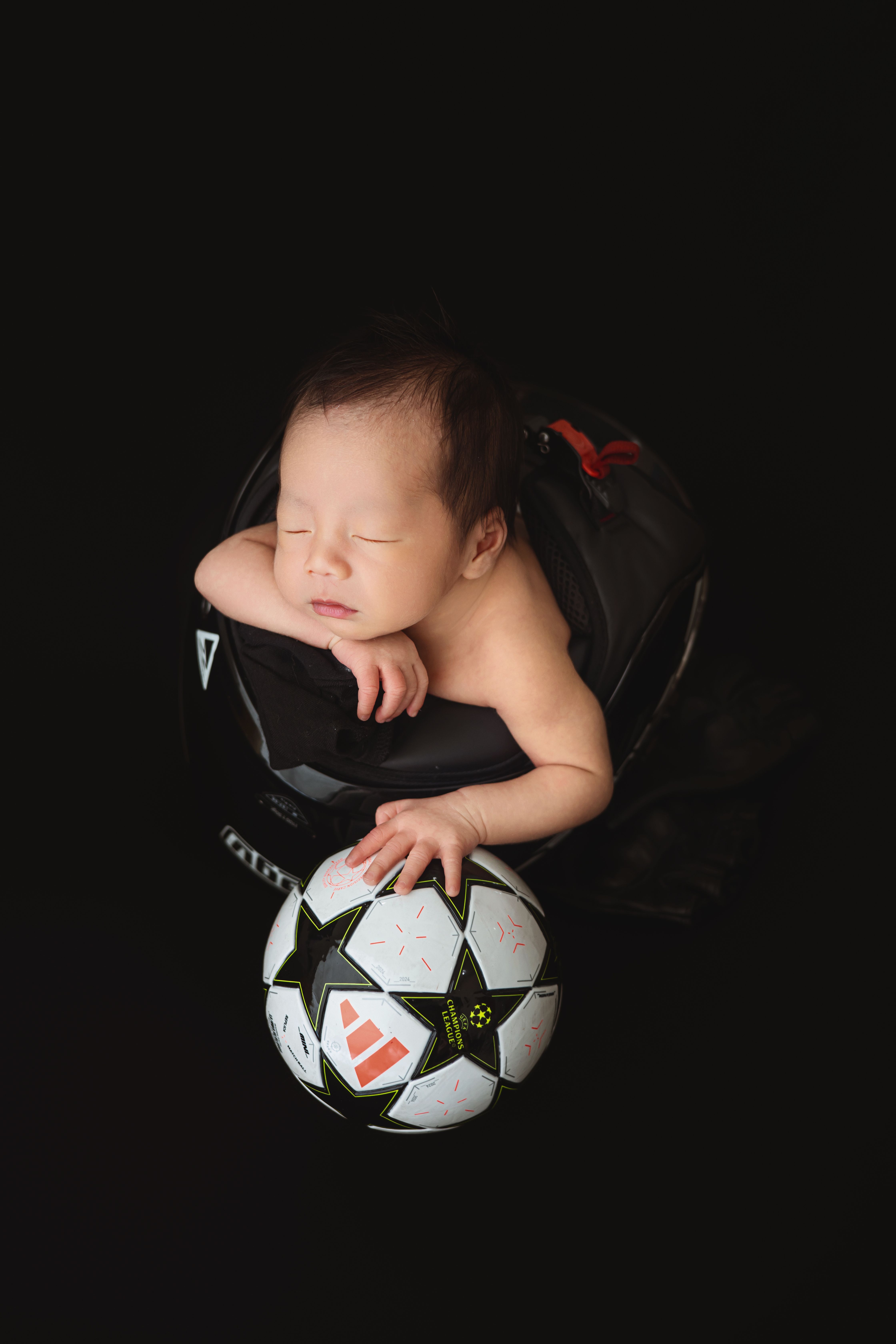 Adorable Sleeping Baby with Soccer Ball Portrait · Free Stock Photo
