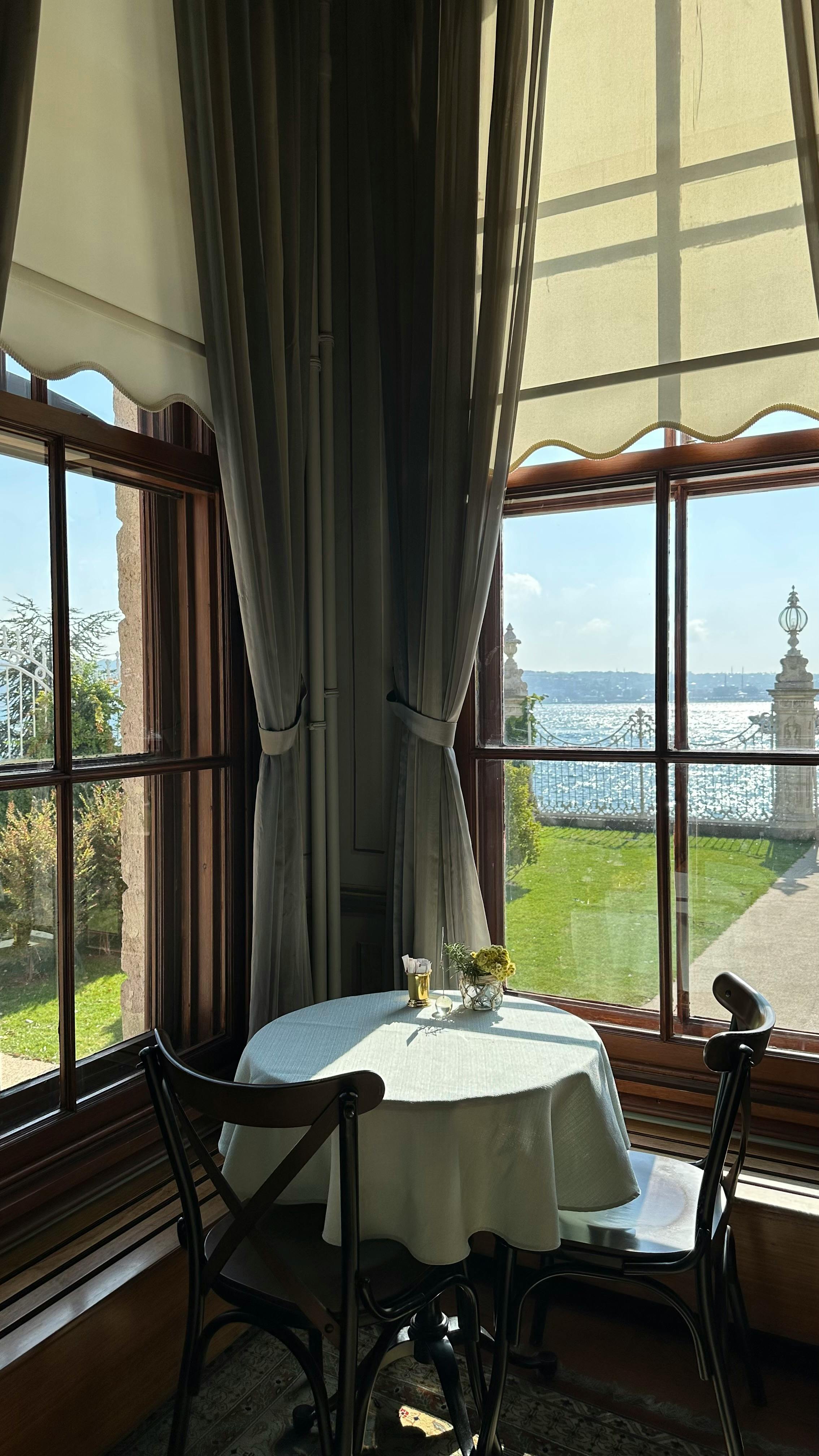 Cozy Window Seating Overlooking Scenic Waterfront · Free Stock Photo