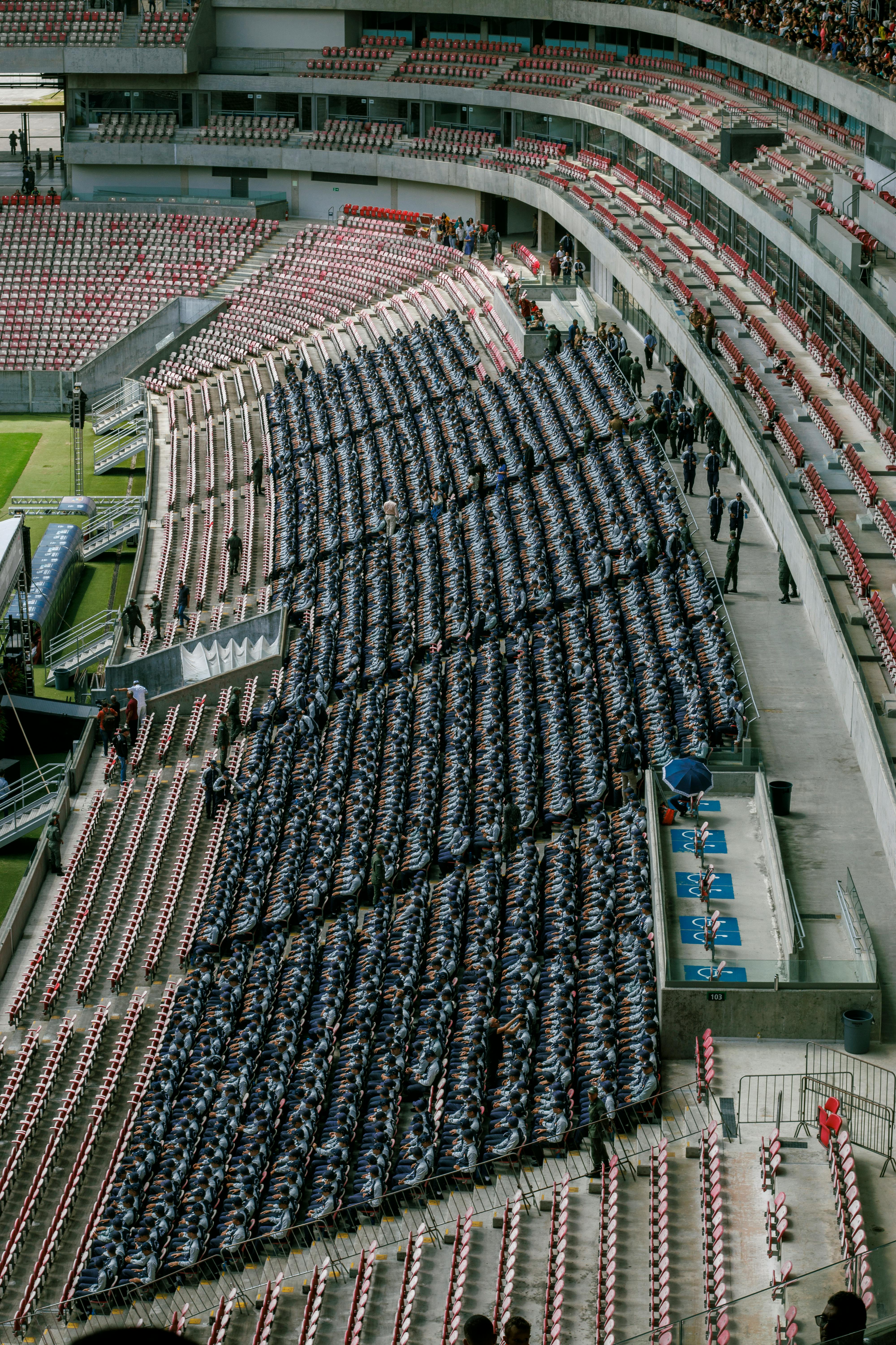 Mass Graduation Ceremony in Stadium Stands · Free Stock Photo
