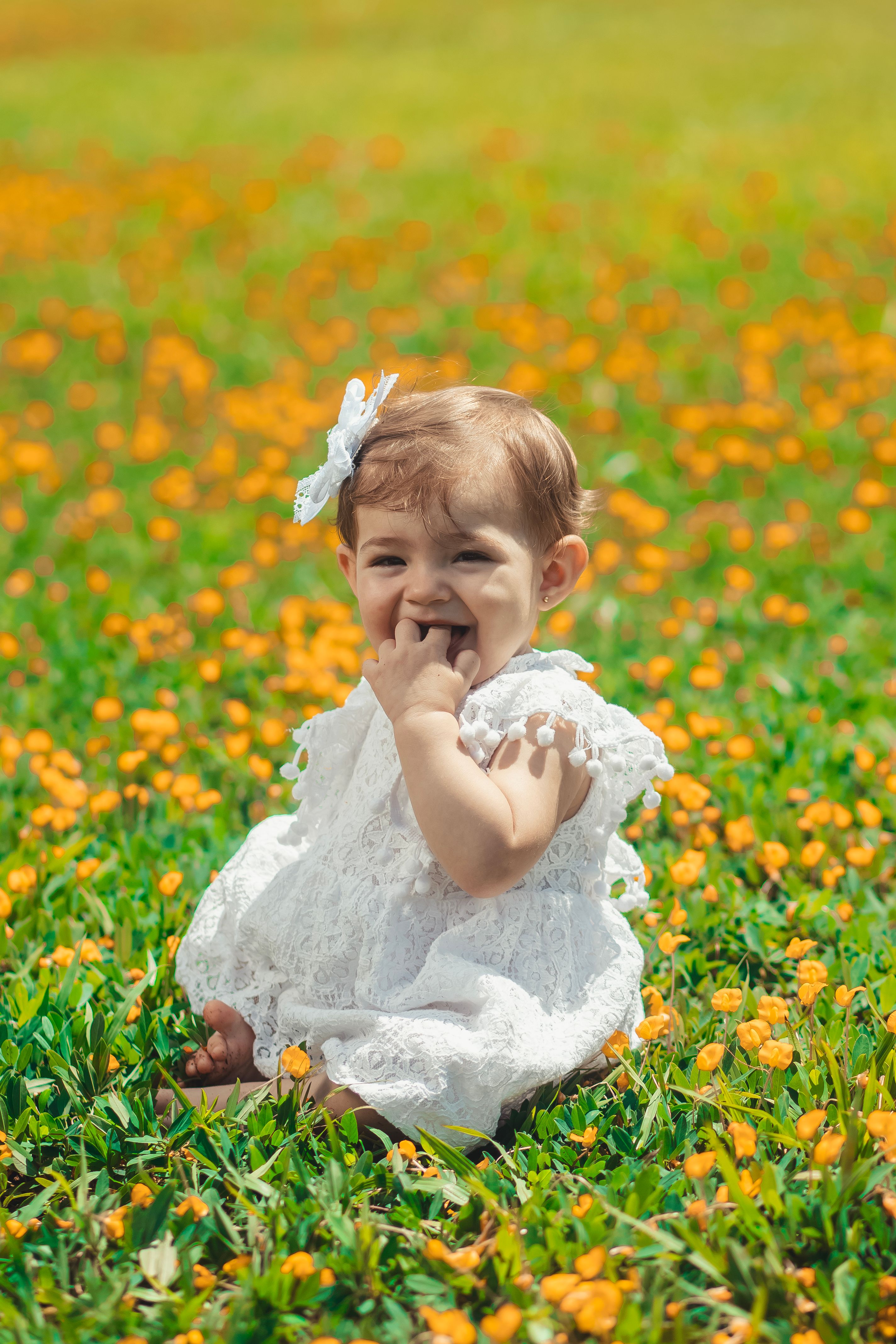 Adorable Baby in Flower Field Enjoying Summer · Free Stock Photo
