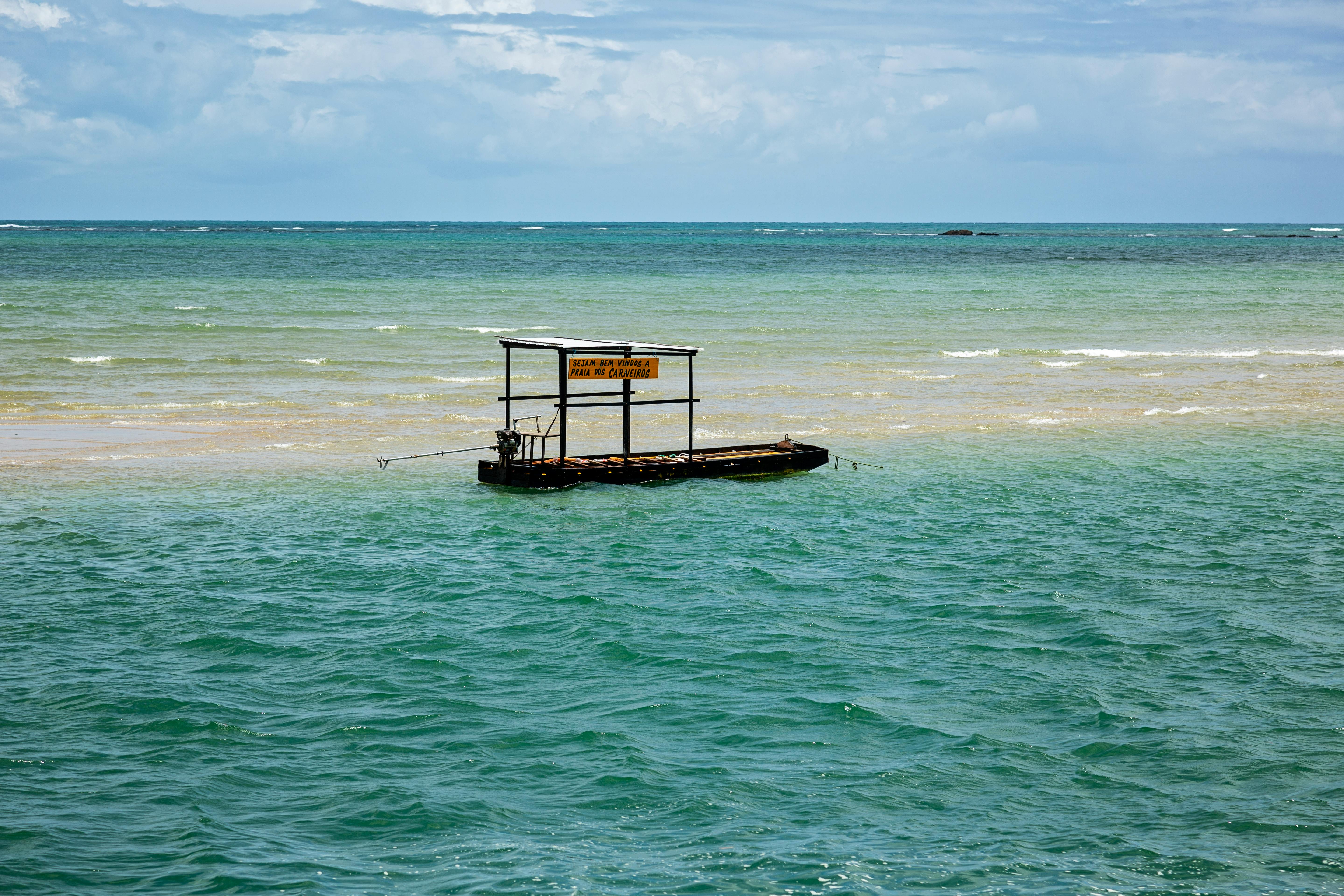 Rustic Raft on Clear Ocean Waters · Free Stock Photo
