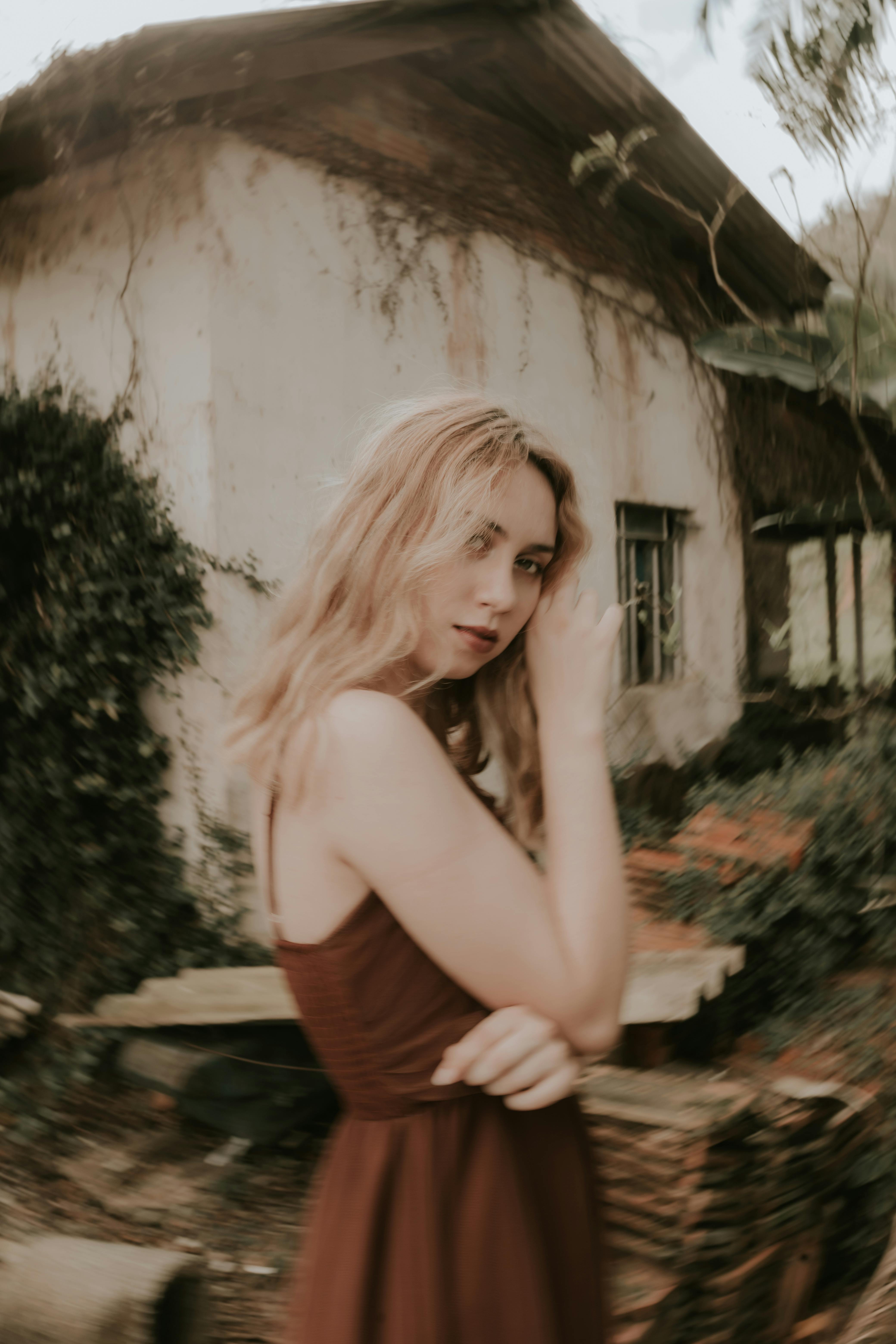 Dreamy Portrait of Woman in Overgrown Garden · Free Stock Photo