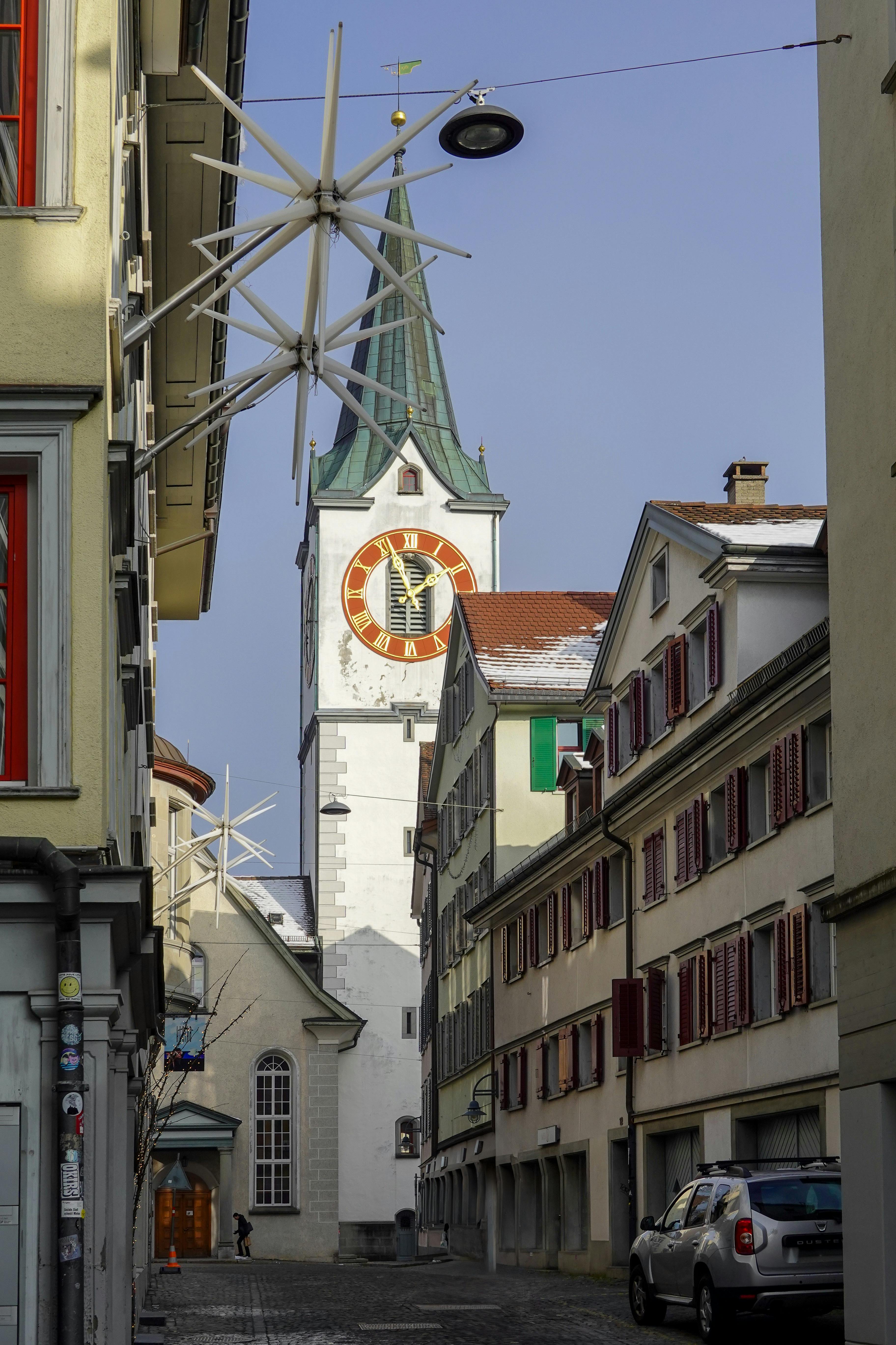 Traditional Swiss Street with Church Tower View · Free Stock Photo
