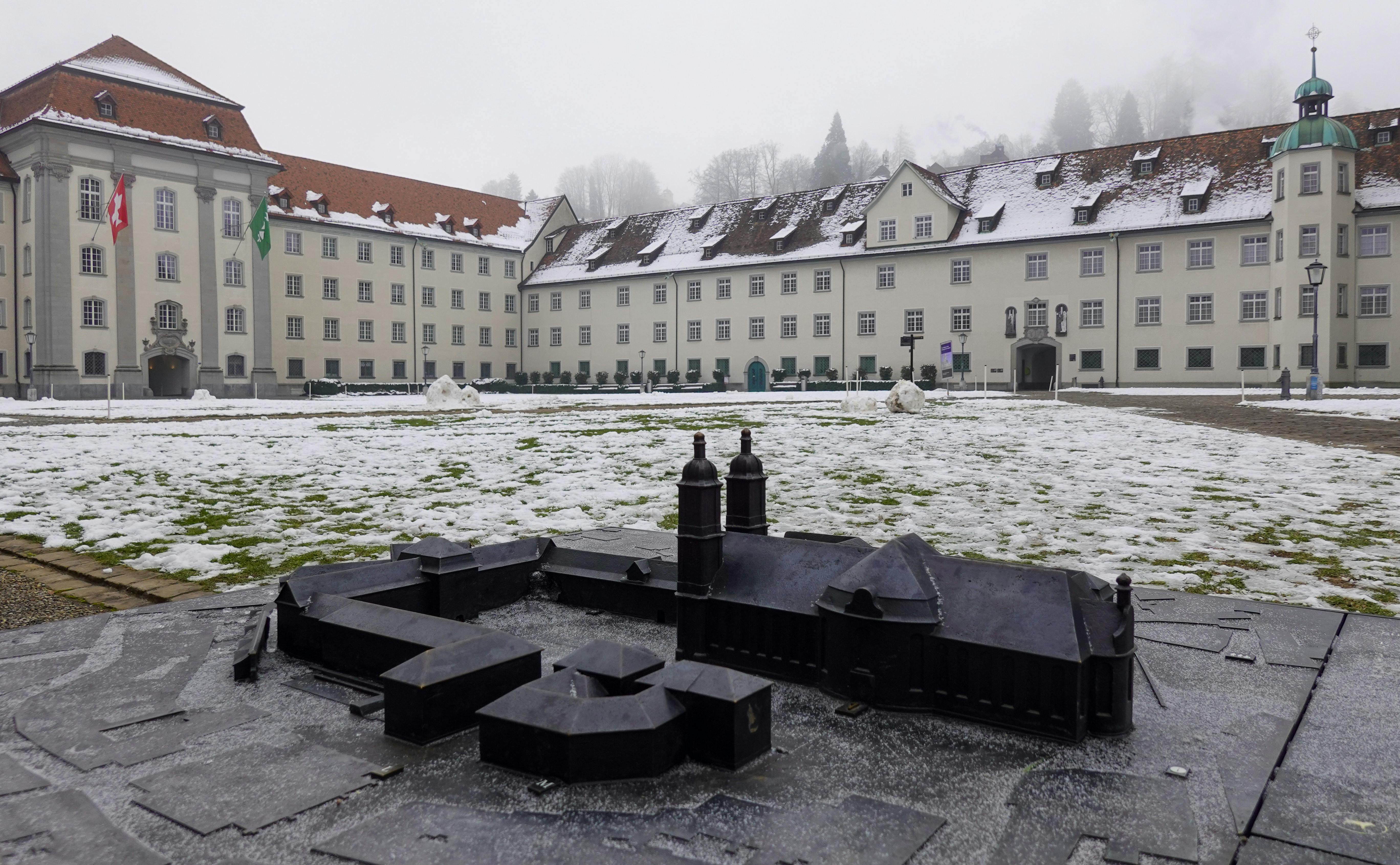 Snow-Covered Swiss Architecture in Winter · Free Stock Photo