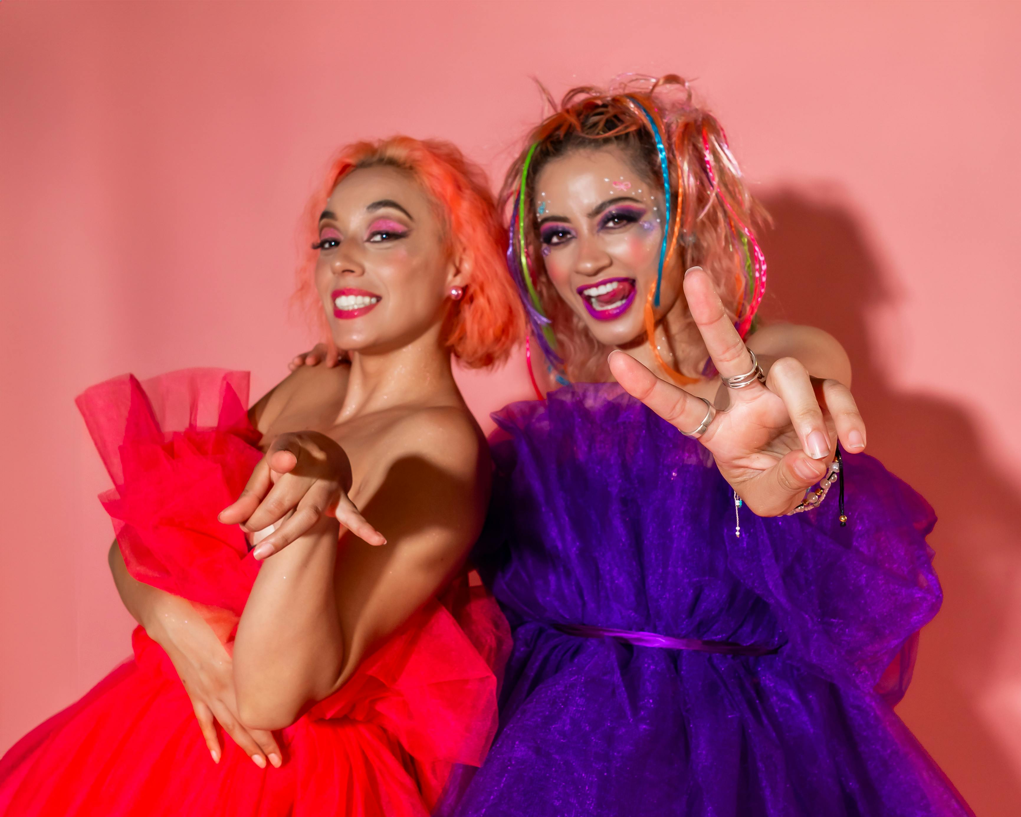 Vibrant Celebration with Glamorous Duo · Free Stock Photo