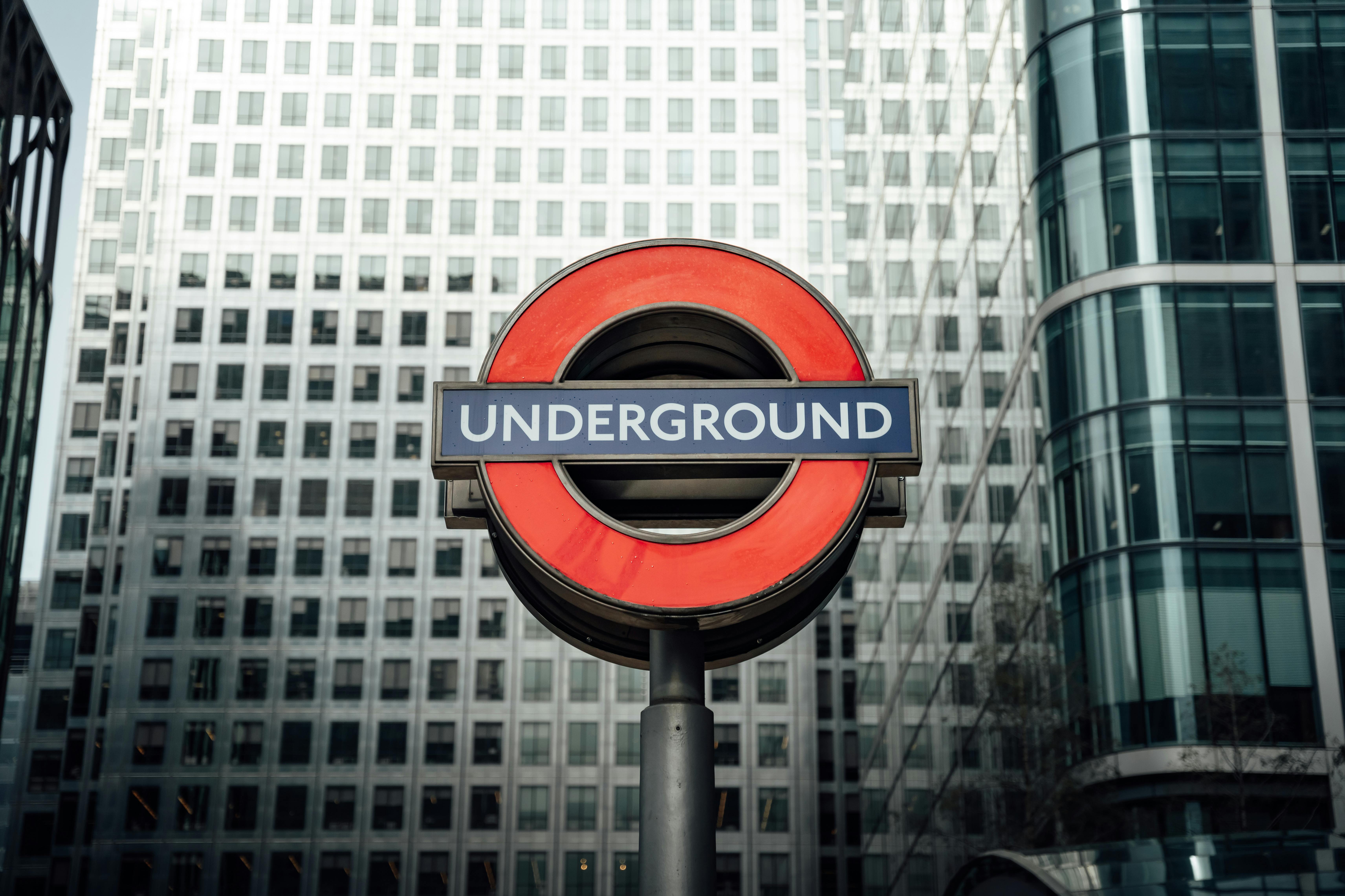 Iconic London Underground Sign in Urban Setting · Free Stock Photo