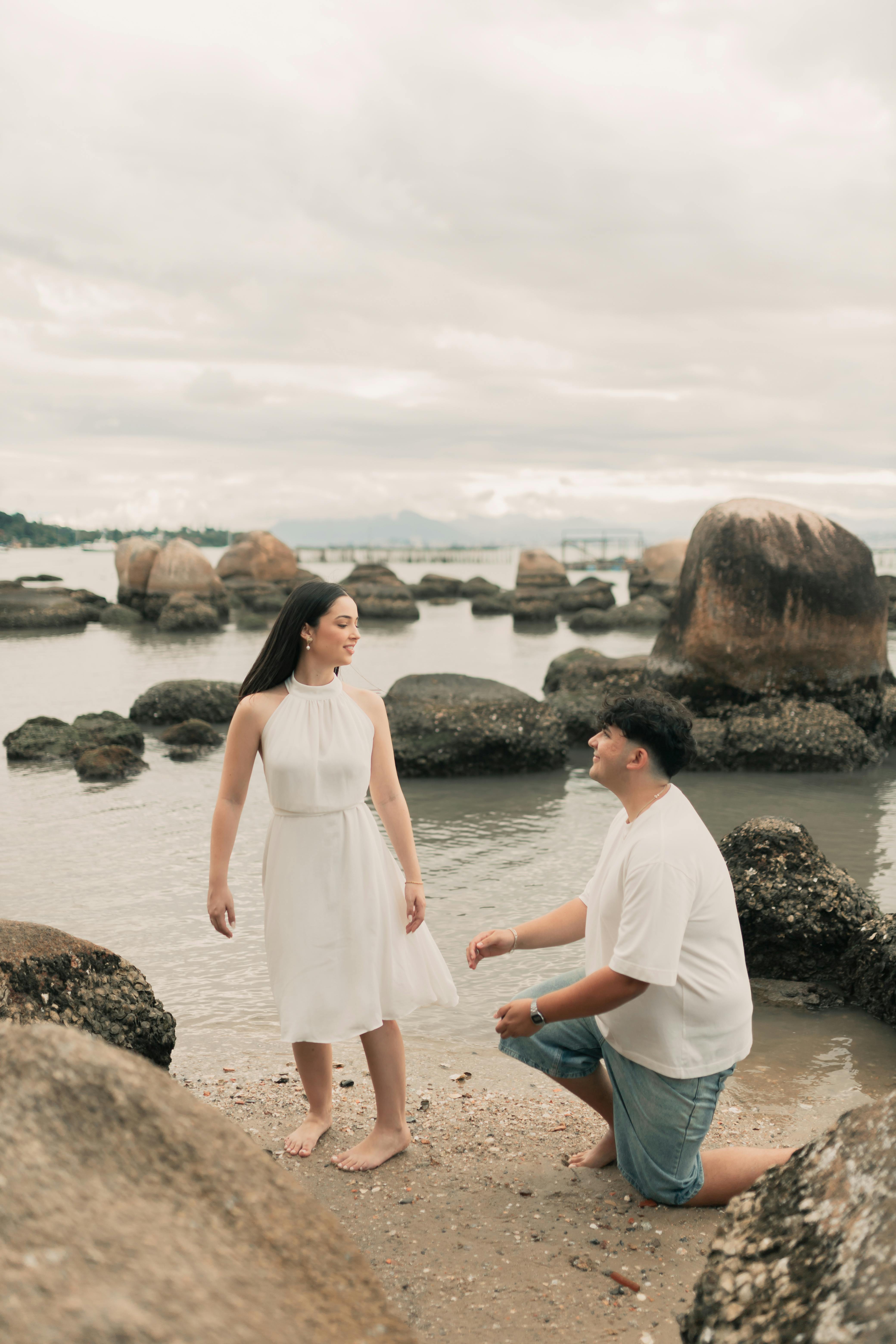 Romantic Proposal at Scenic Rocky Beach · Free Stock Photo