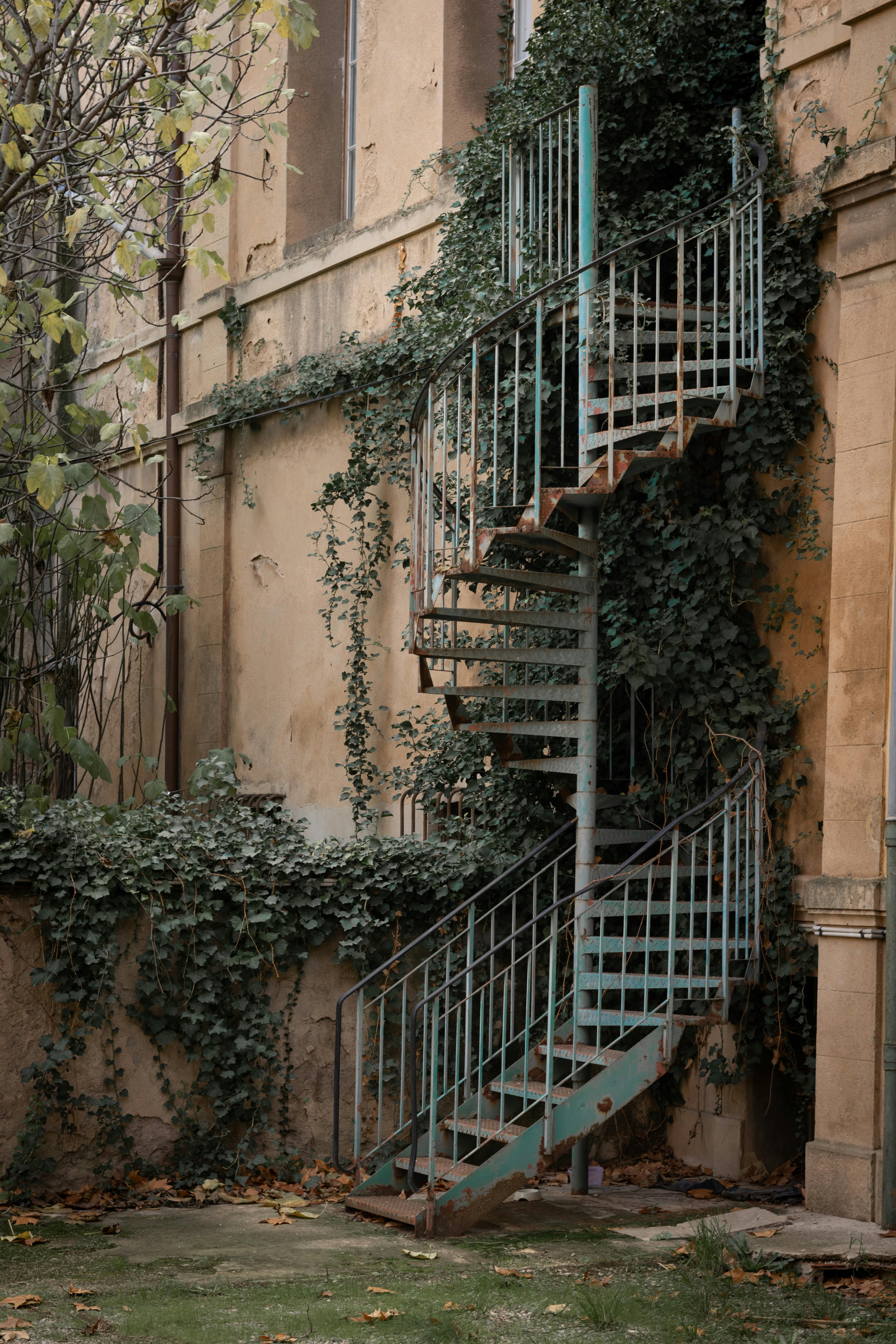 Rustic Spiral Staircase in Provence Garden · Free Stock Photo