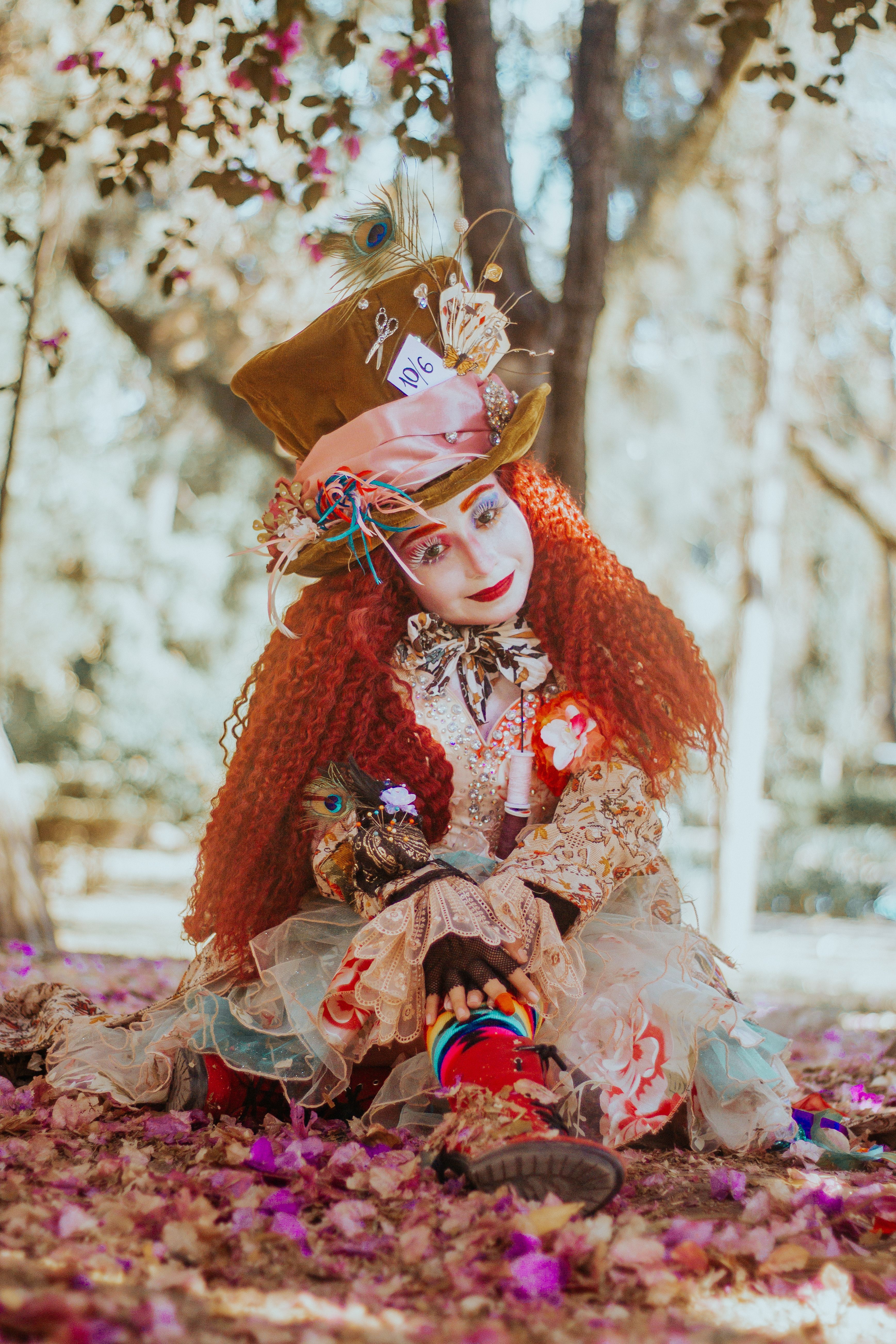 Whimsical Mad Hatter Portrait in Blooming Park · Free Stock Photo