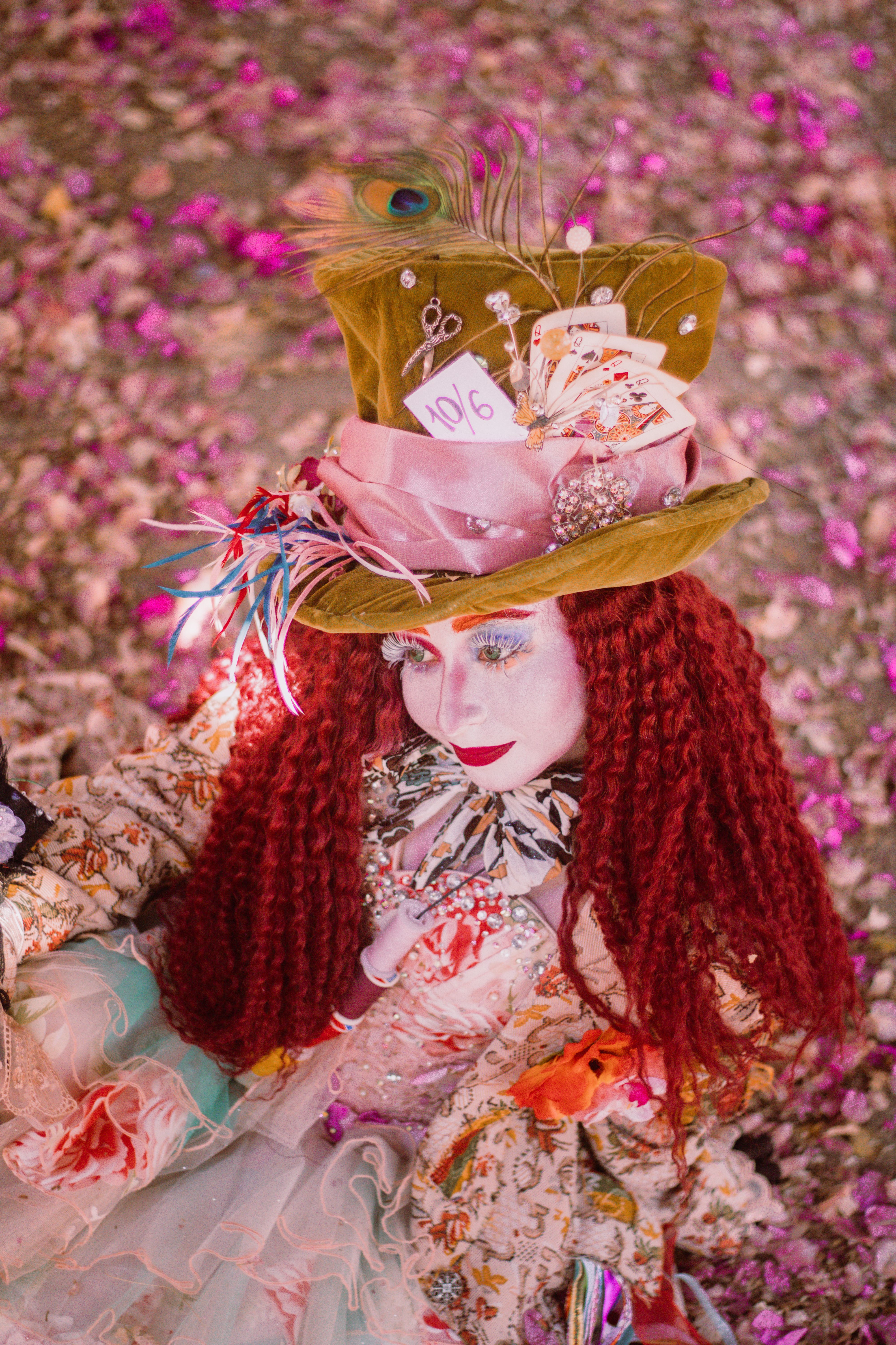 Whimsical Mad Hatter Portrait with Floral Background · Free Stock Photo