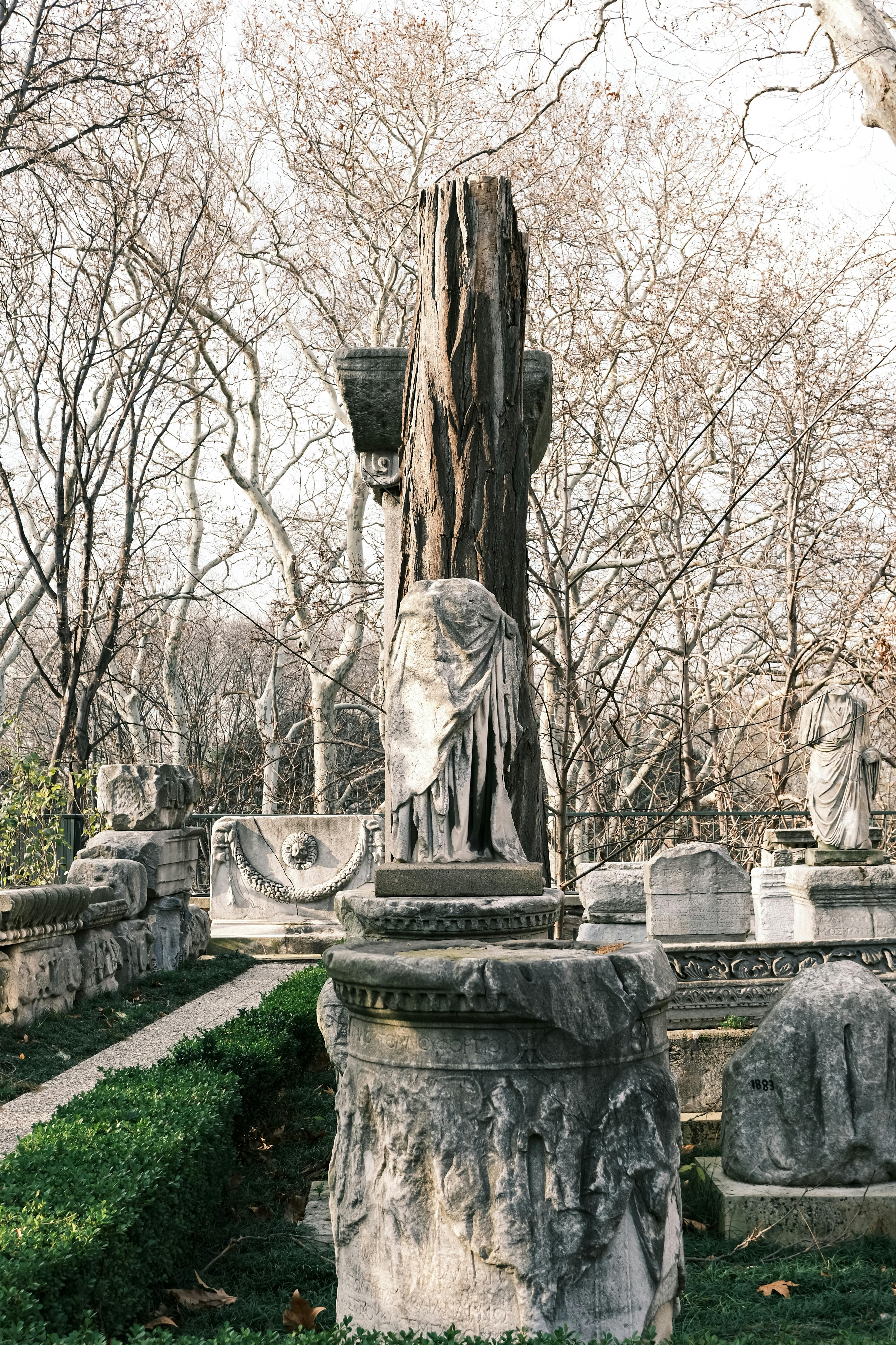 Ancient Stone Monuments in Leafless Park Setting · Free Stock Photo