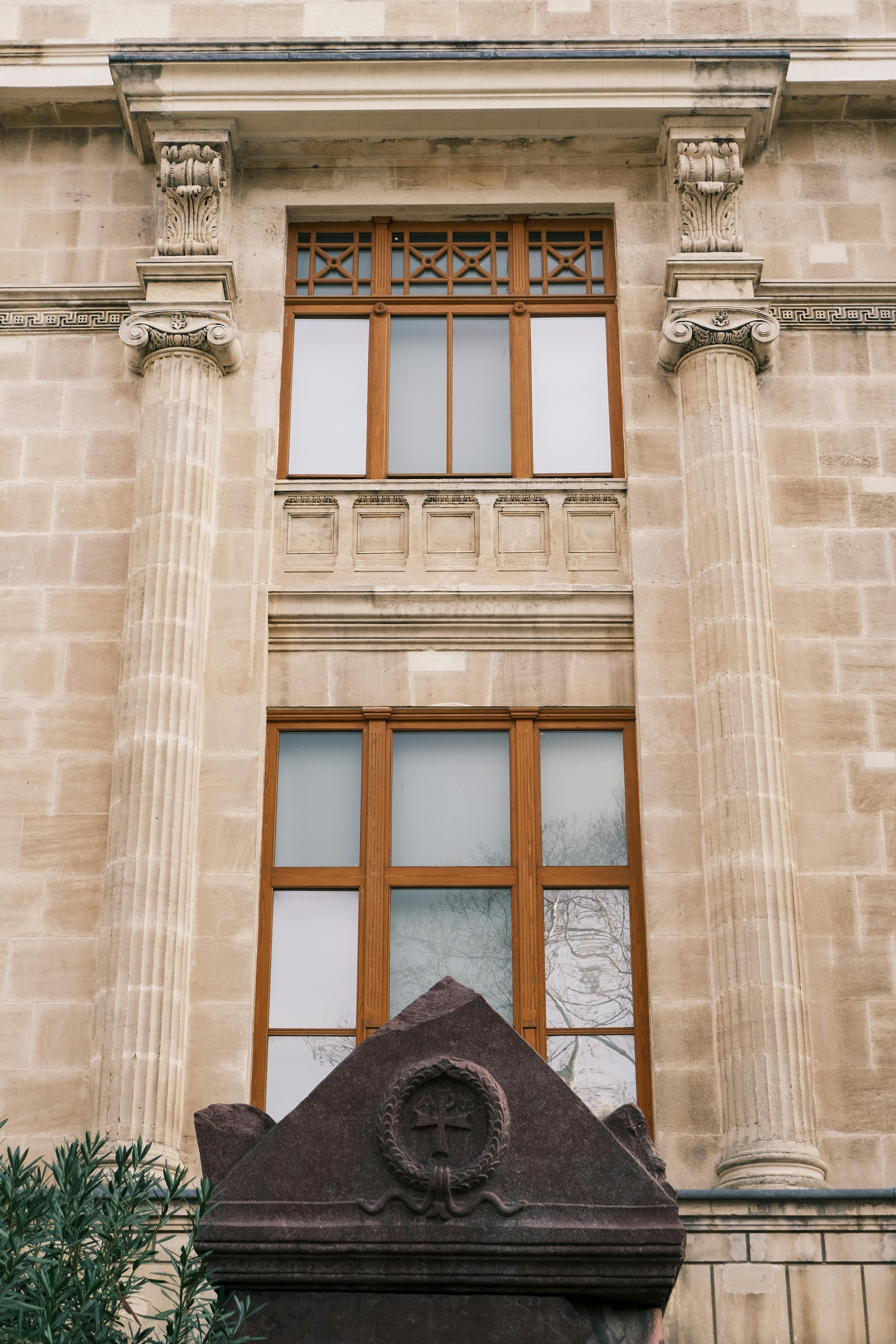 Classical Architecture with Stone Columns and Windows · Free Stock Photo