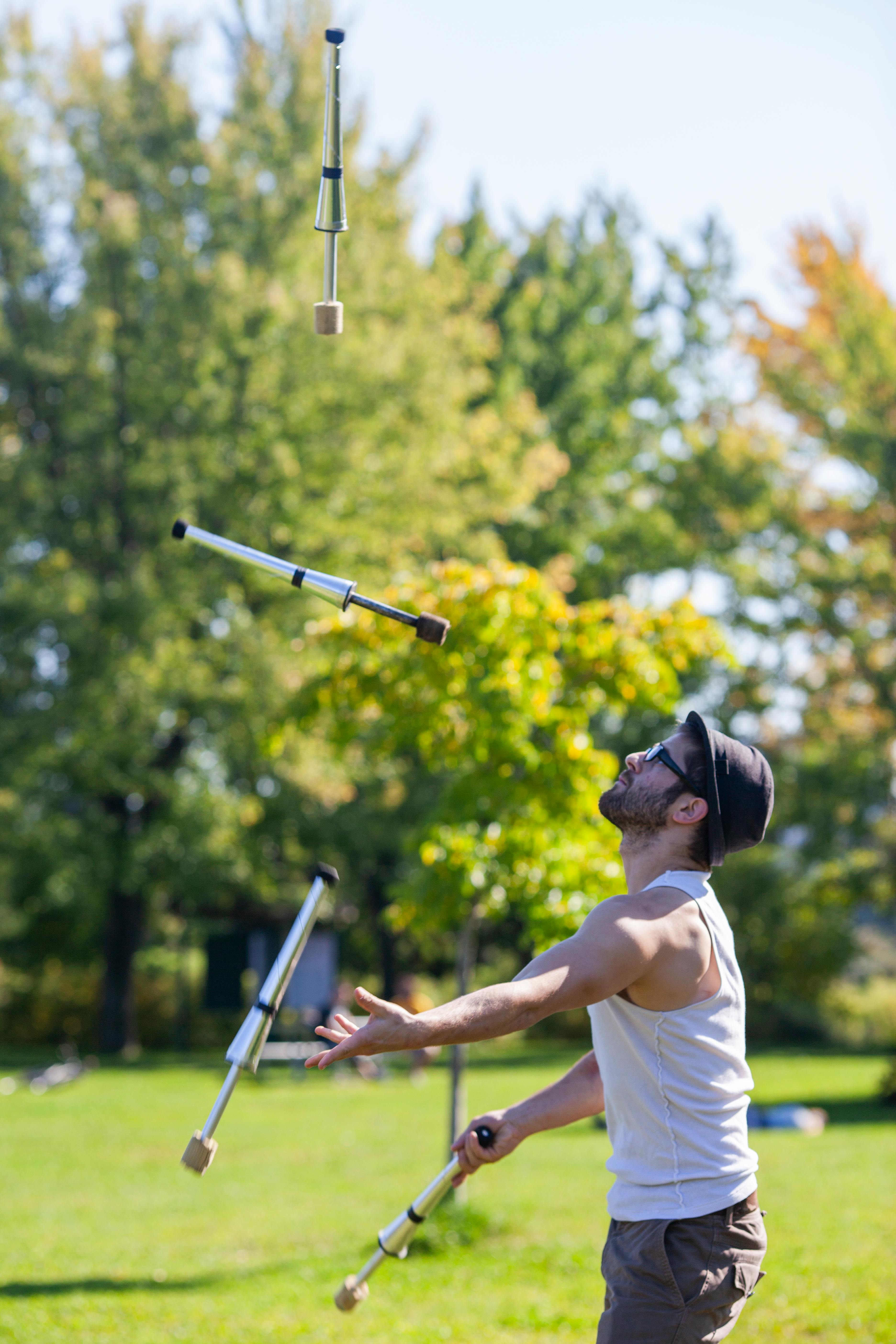 Juggler Performing Outdoors in Québec Park · Free Stock Photo