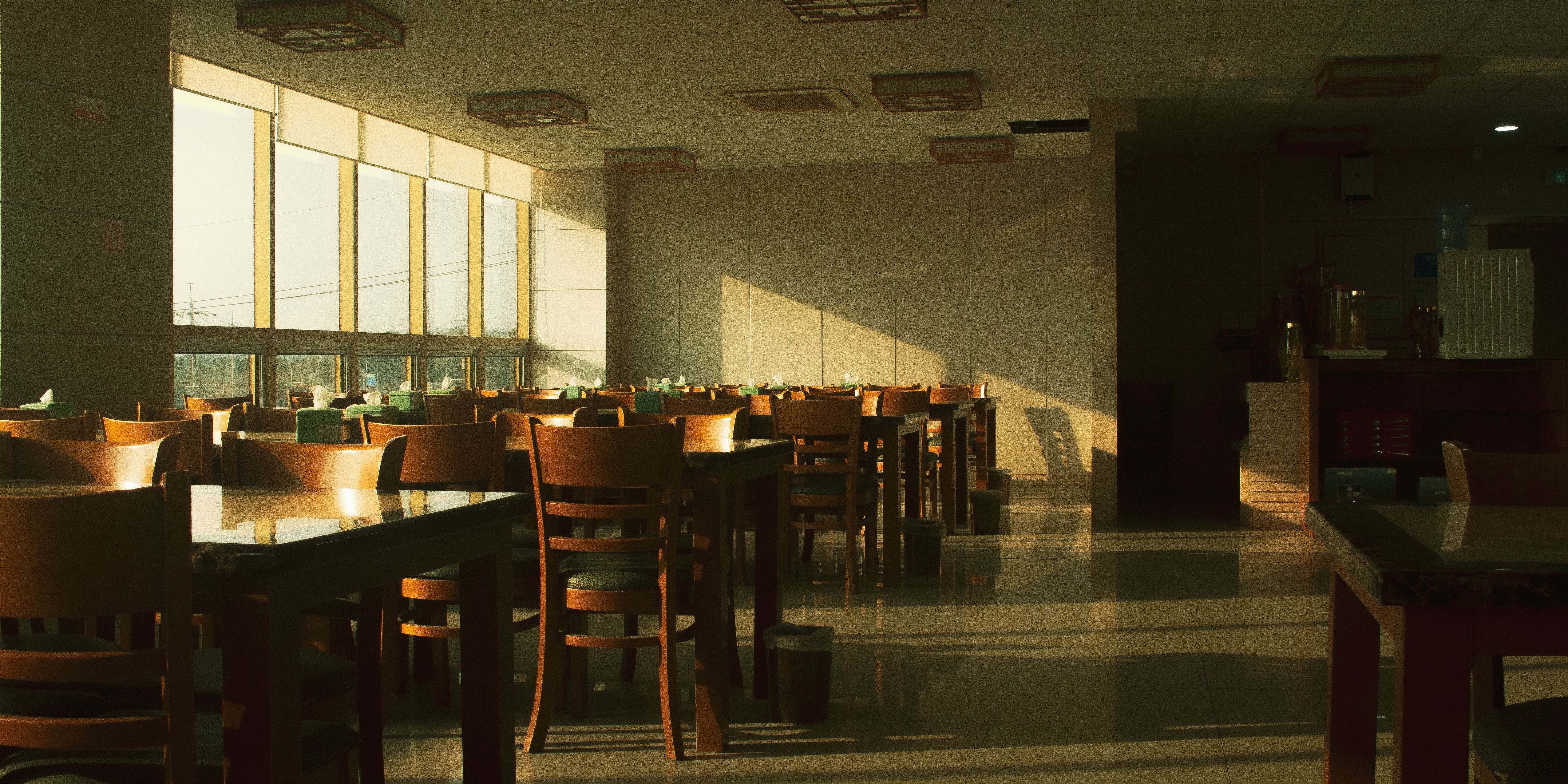 Quiet Indoor Restaurant with Sunlit Tables · Free Stock Photo