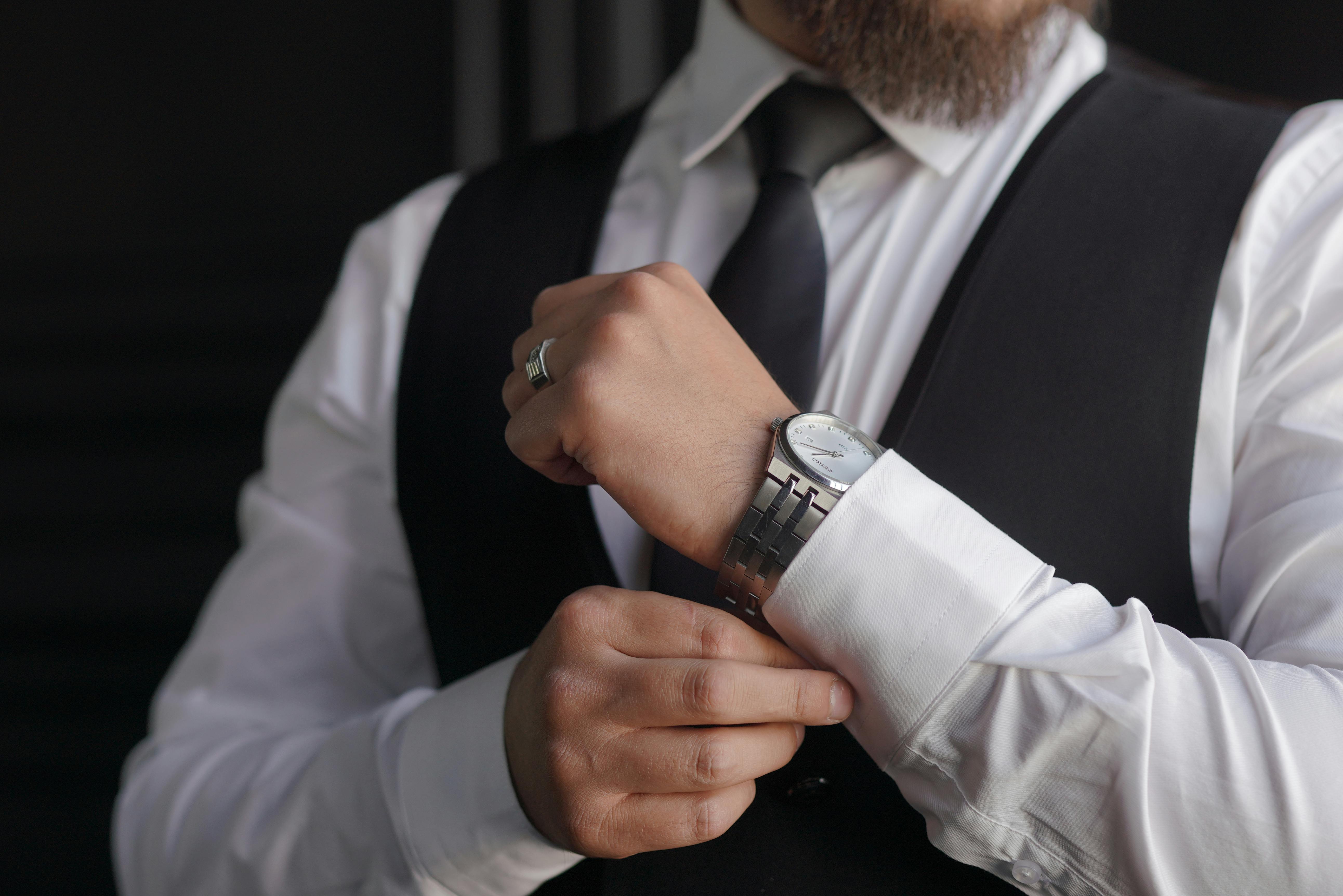 Fashionable Groom Adjusting Cufflinks at Wedding · Free Stock Photo