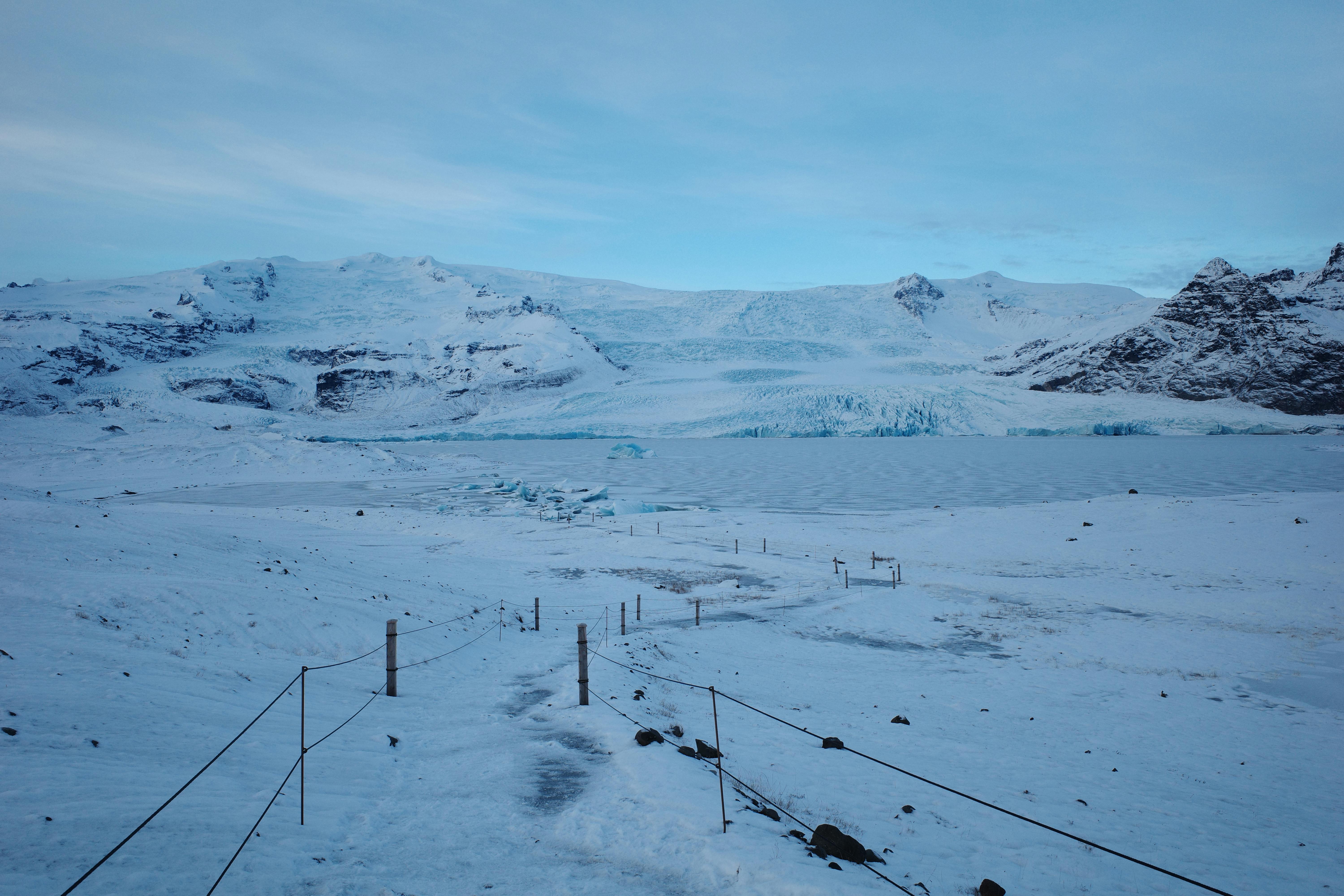 Icy Landscape with Snow-Covered Mountains · Free Stock Photo
