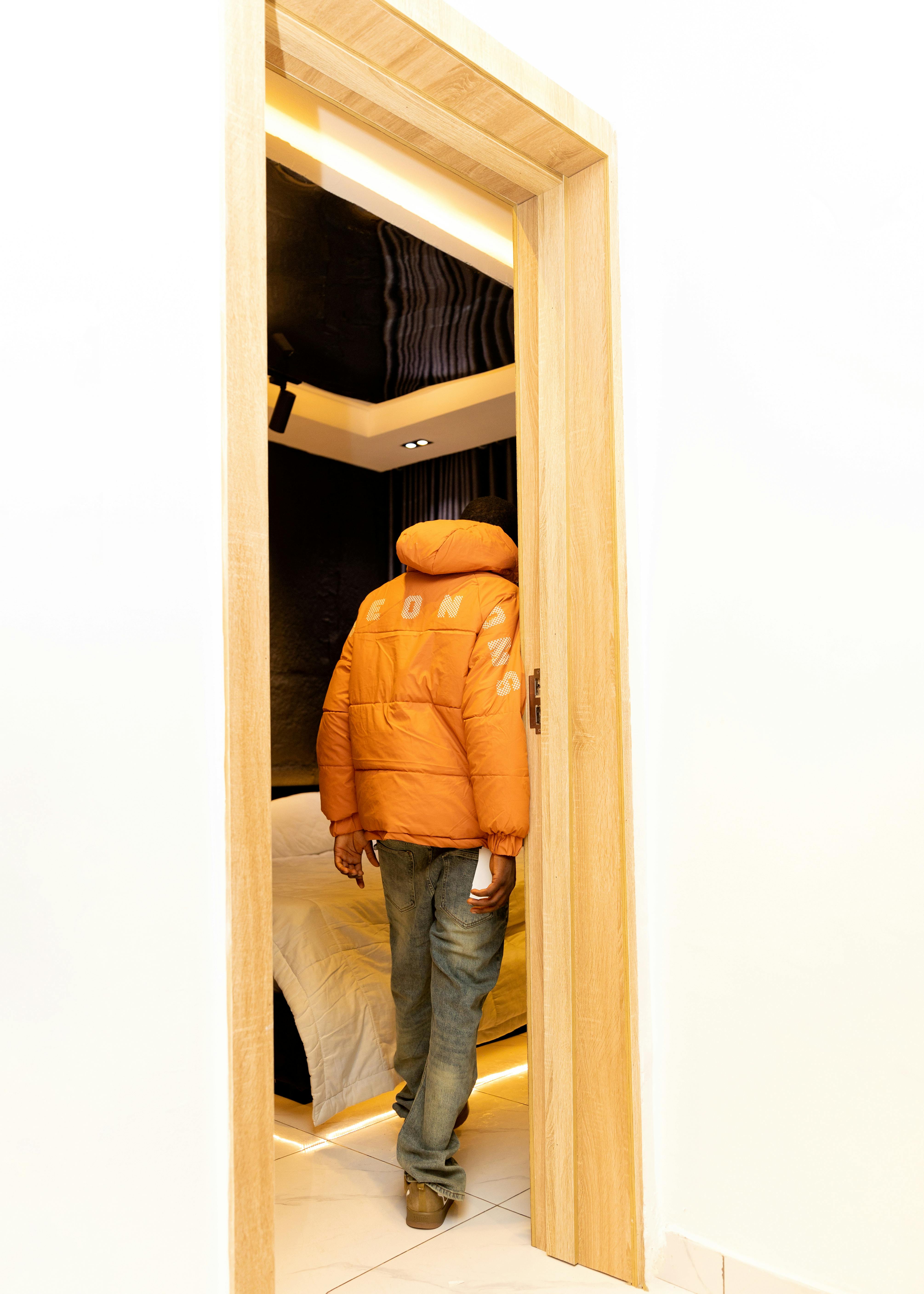 Person Entering a Modern Room Through Doorway · Free Stock Photo