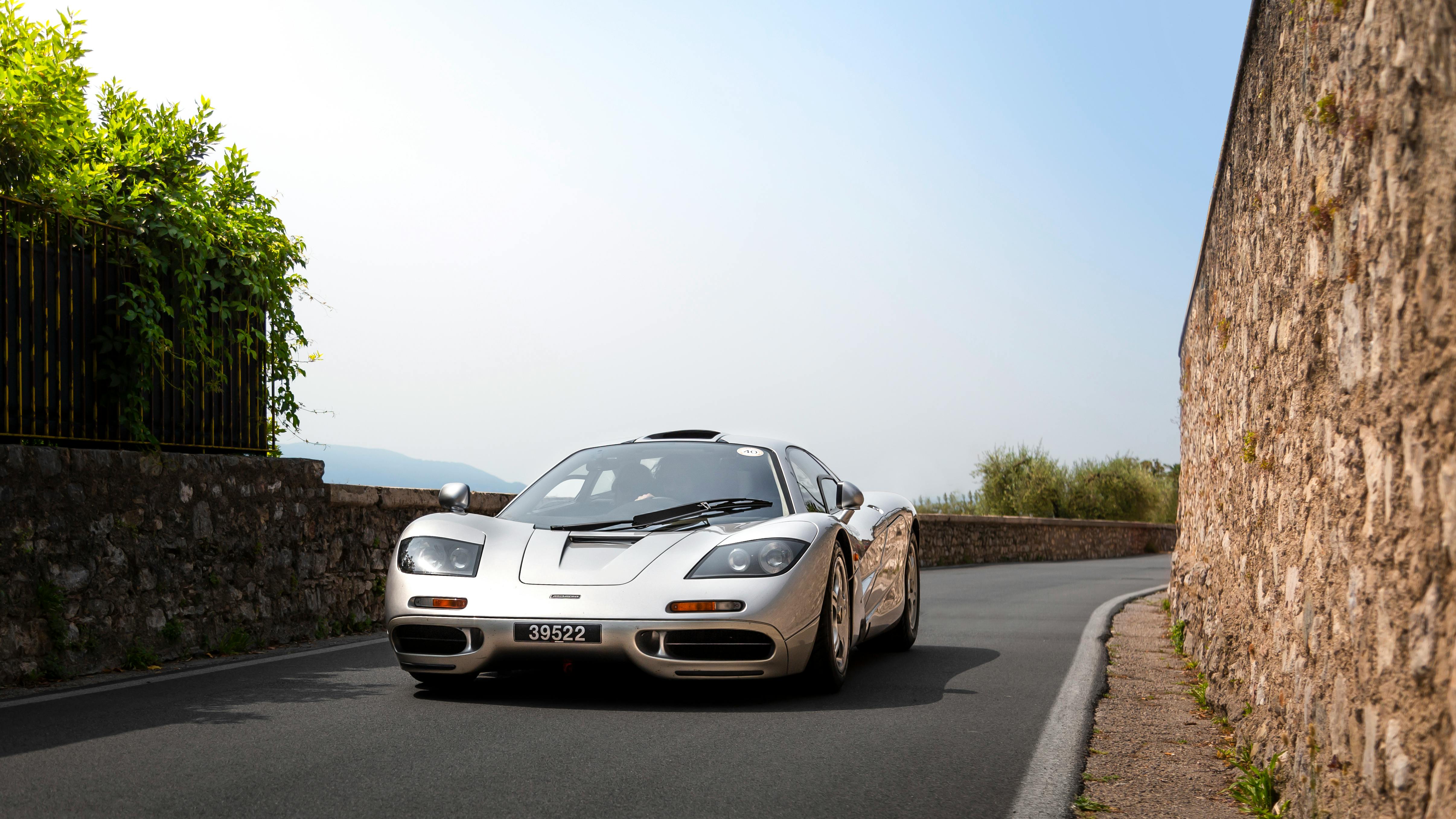 Silver Supercar on Scenic Mountain Road · Free Stock Photo