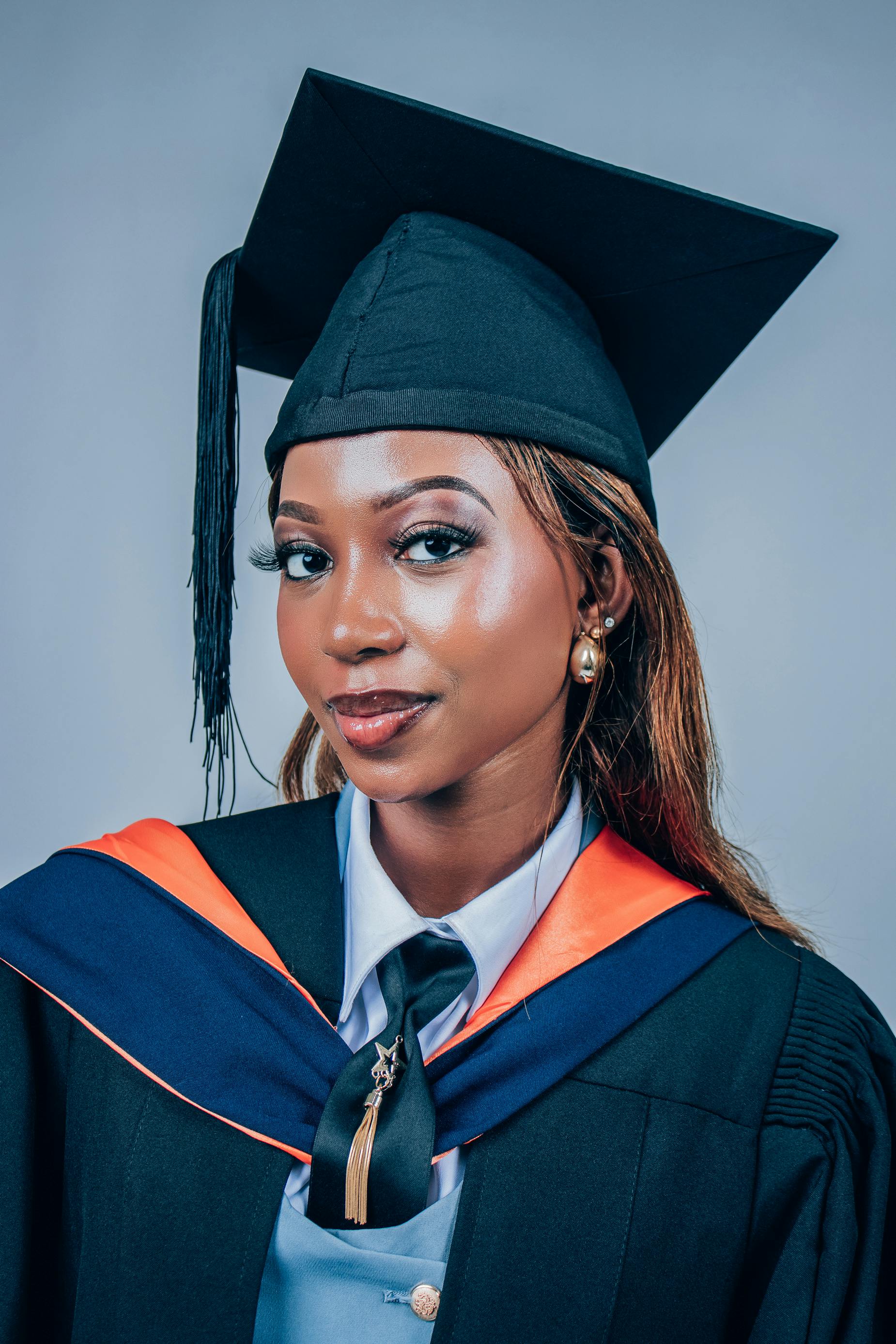 Elegant African Graduate in Cap and Gown · Free Stock Photo