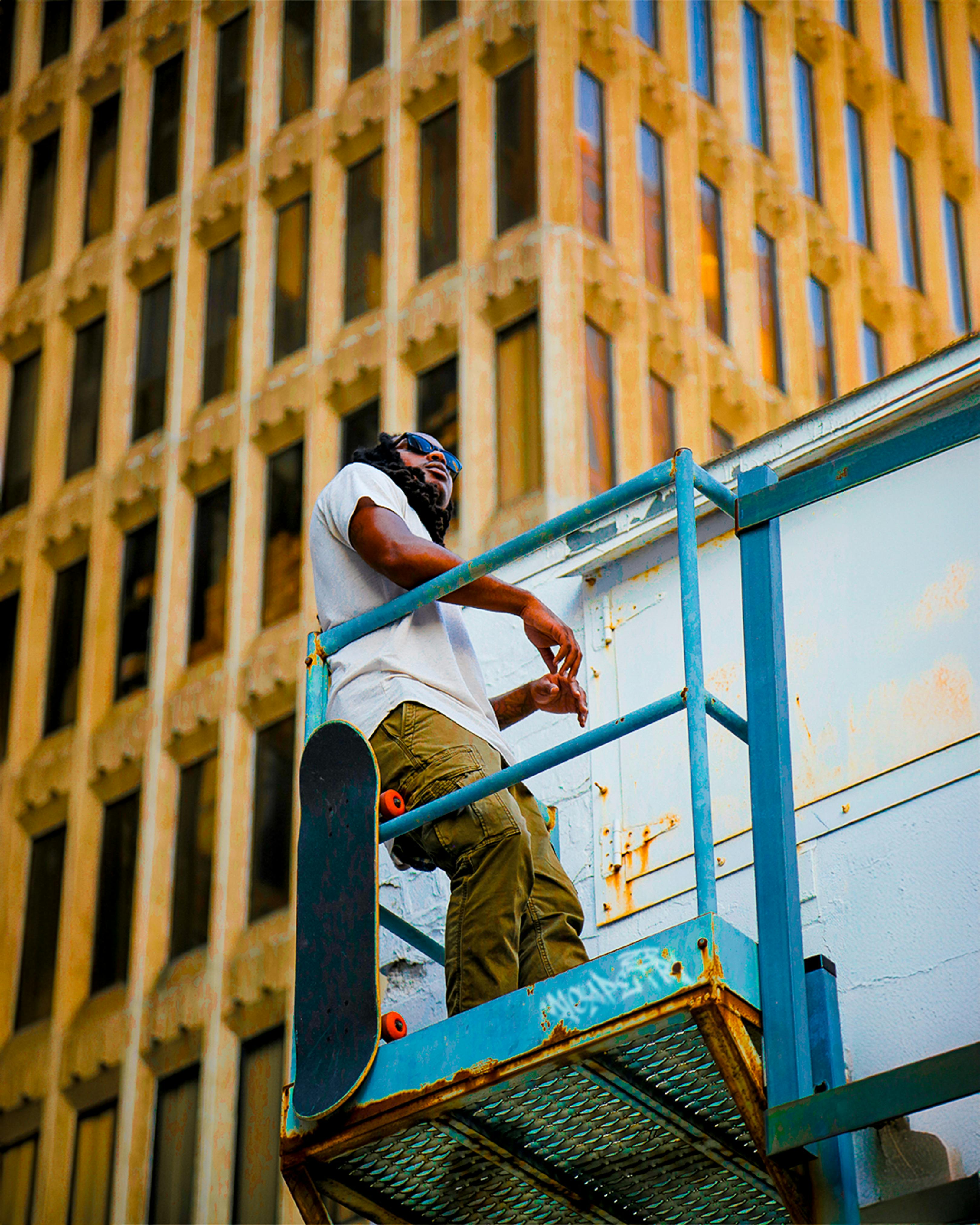 Urban Skater Relaxing at Atlanta Highrise · Free Stock Photo