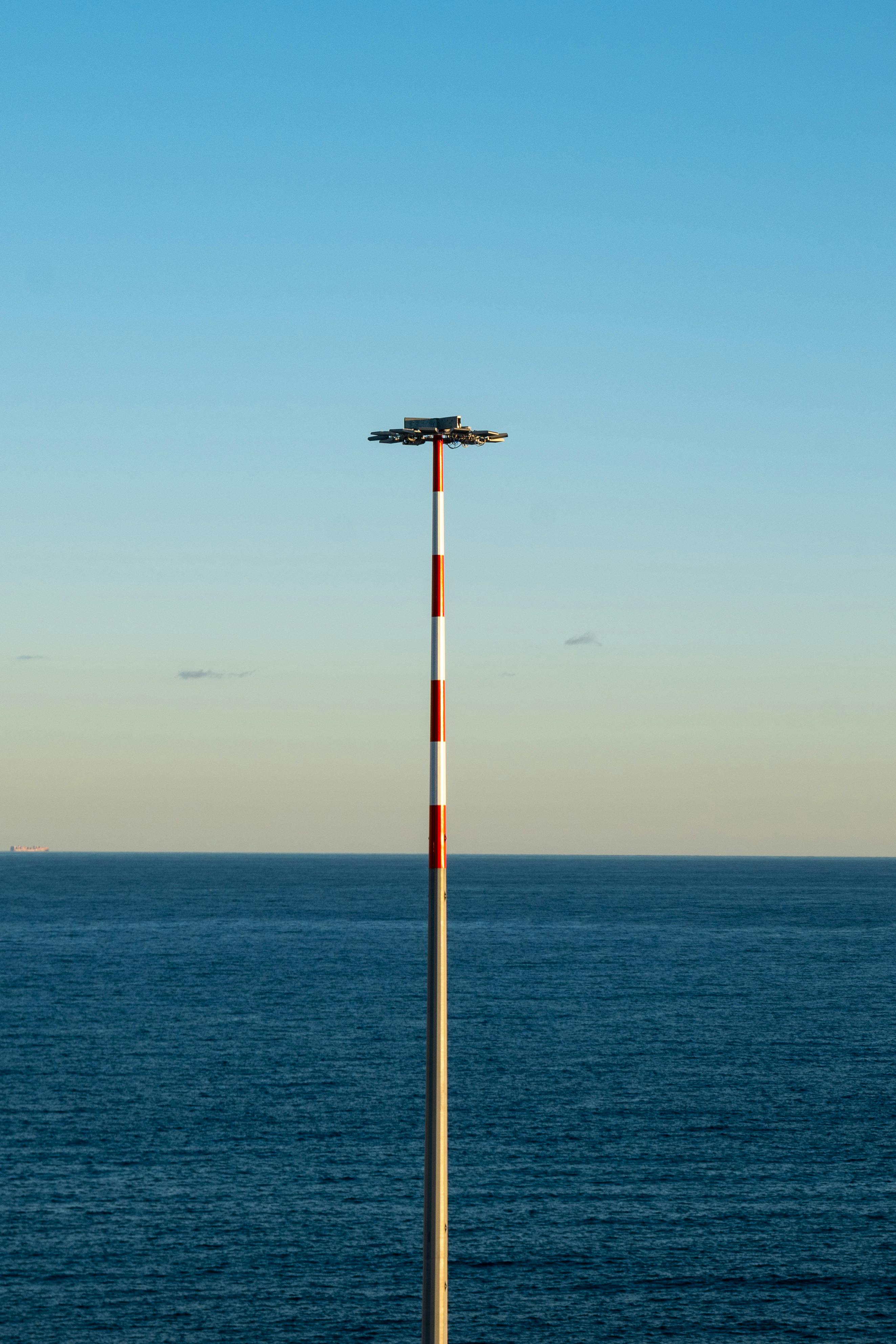 Aerial Beacon Pole Over Serene Sea in Savona, Italy · Free Stock Photo