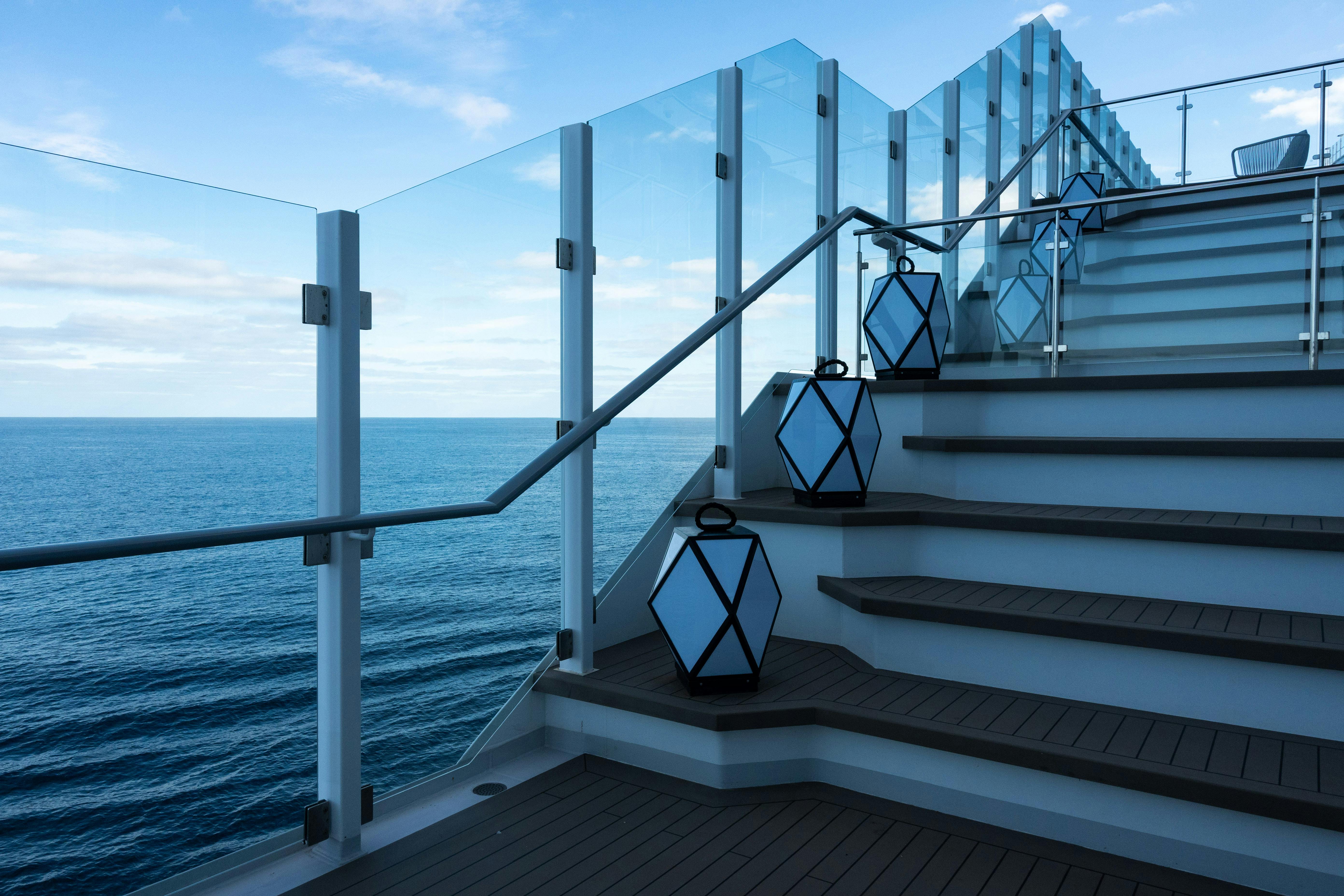 Modern Glass Staircase Overlooking Ocean View · Free Stock Photo