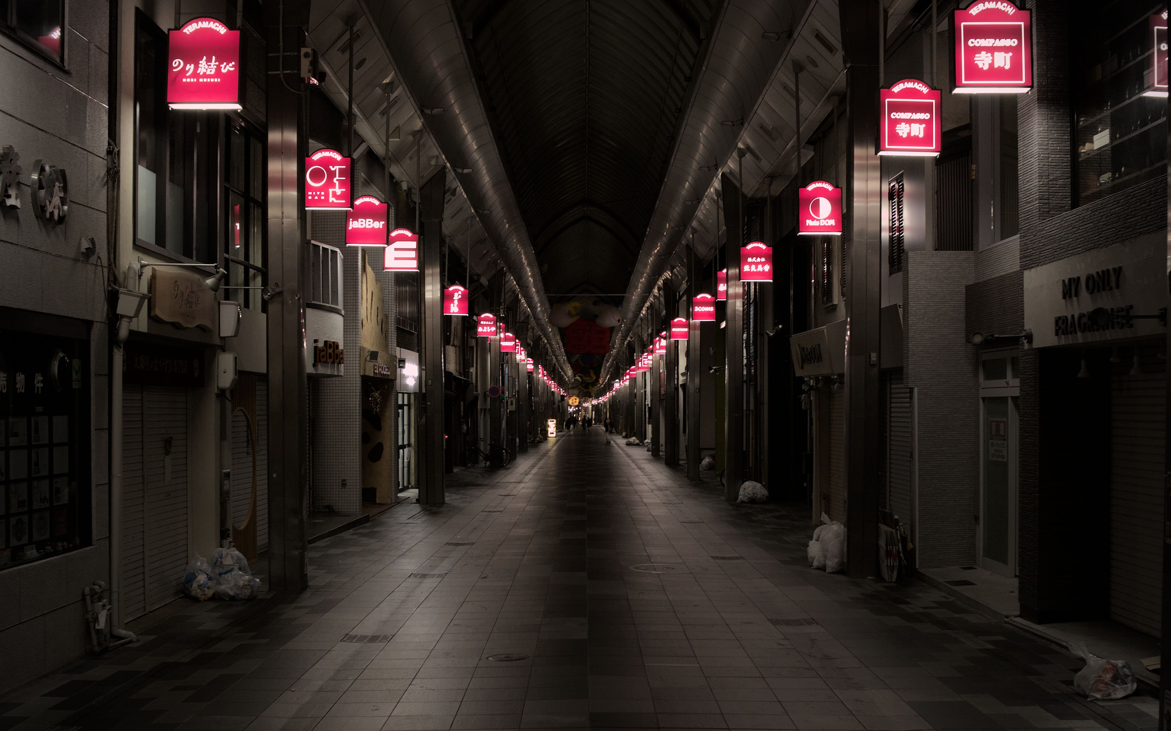 Empty Shopping Arcade at Night with Neon Signs · Free Stock Photo