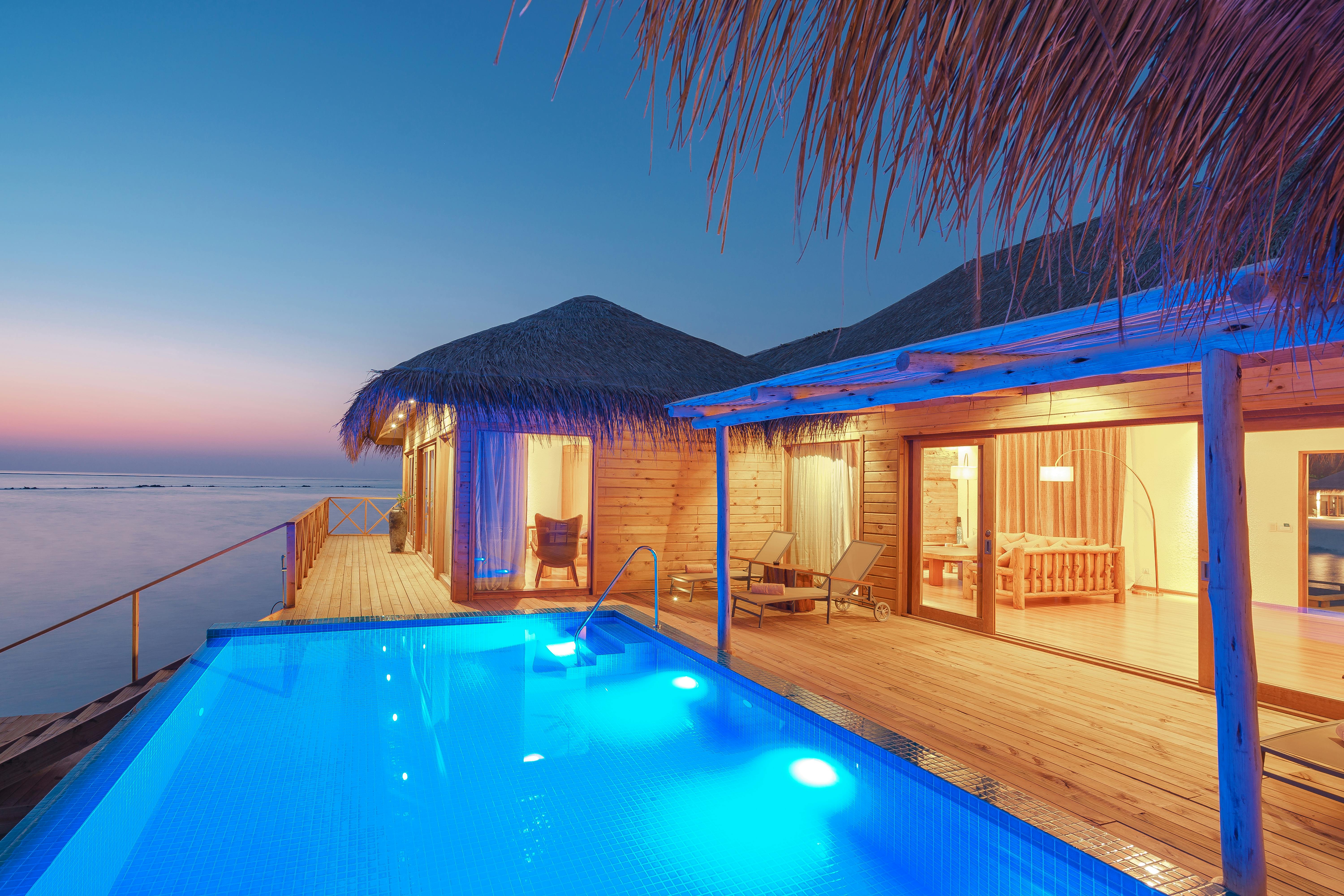 Luxurious Overwater Bungalow with Infinity Pool at Sunset · Free Stock ...
