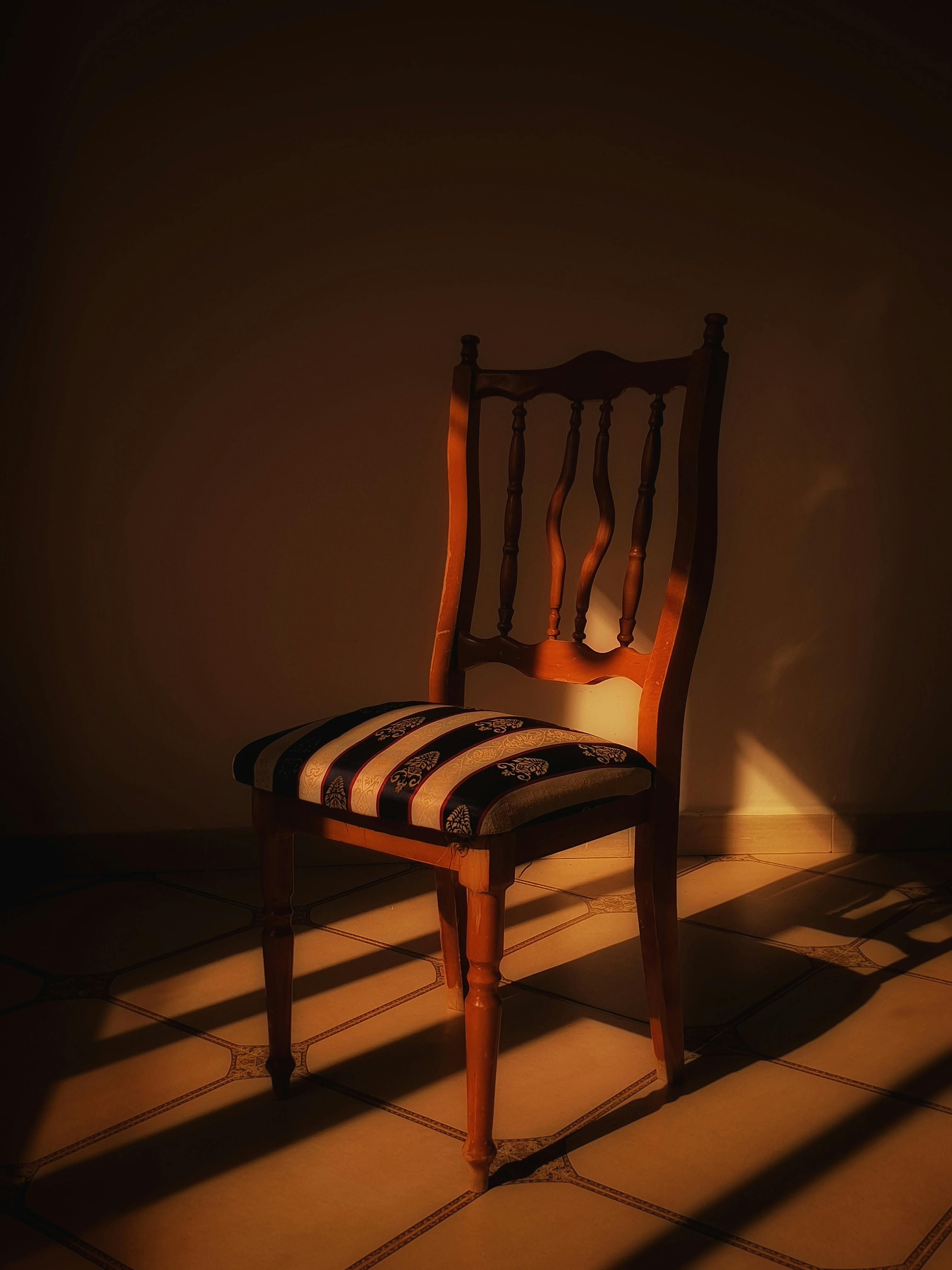 Elegant Wooden Chair in Warm Evening Light · Free Stock Photo