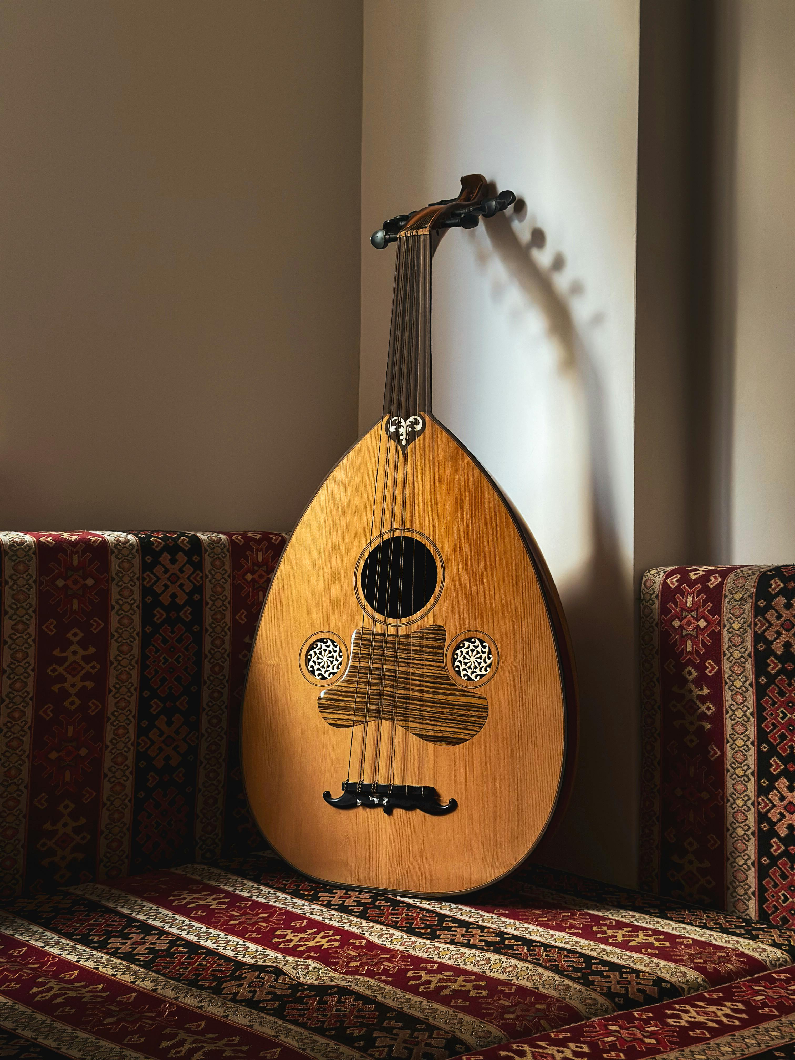 Traditional Oud on Patterned Sofa in Bolu · Free Stock Photo