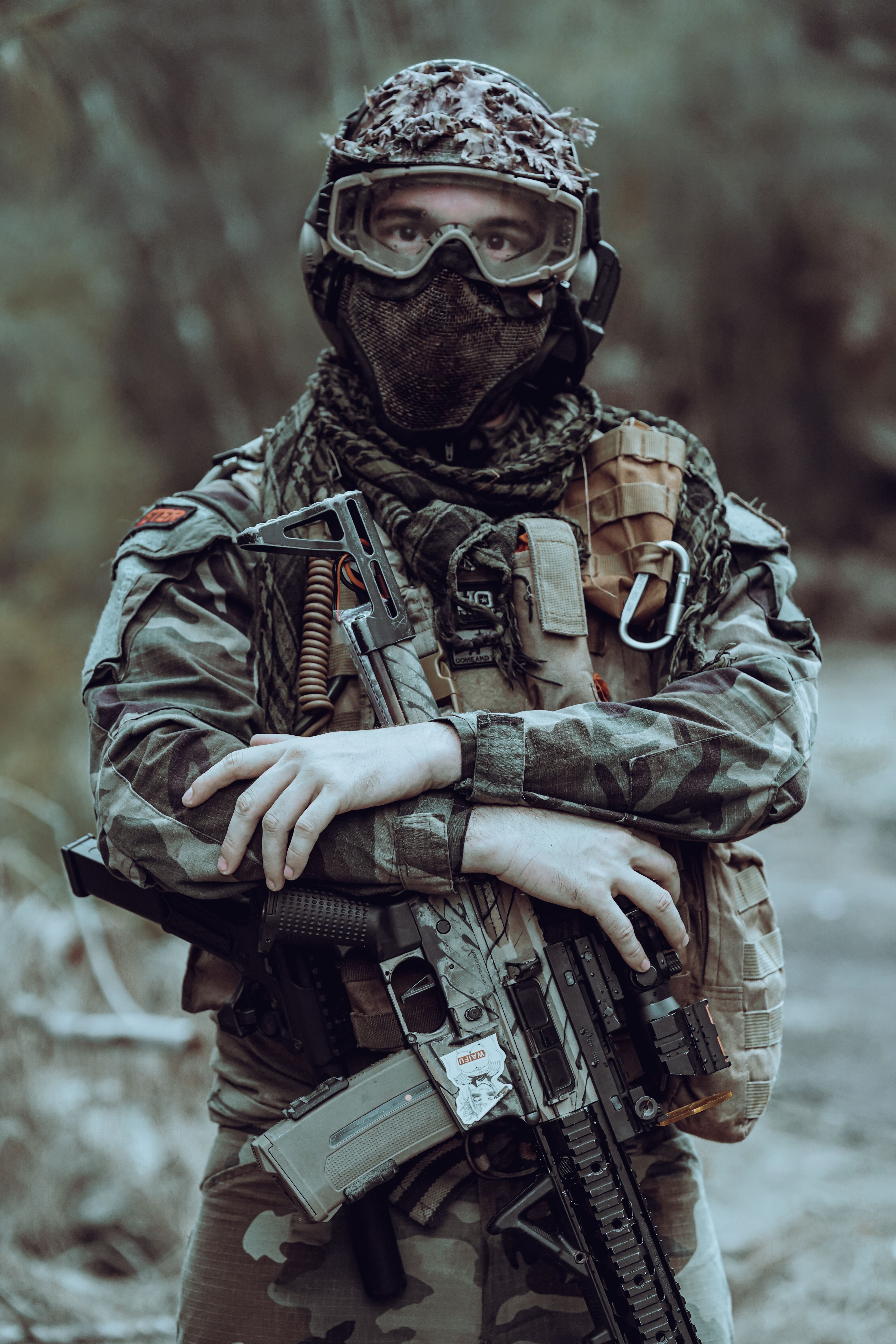 Camouflaged Soldier in Tactical Gear Outdoors · Free Stock Photo