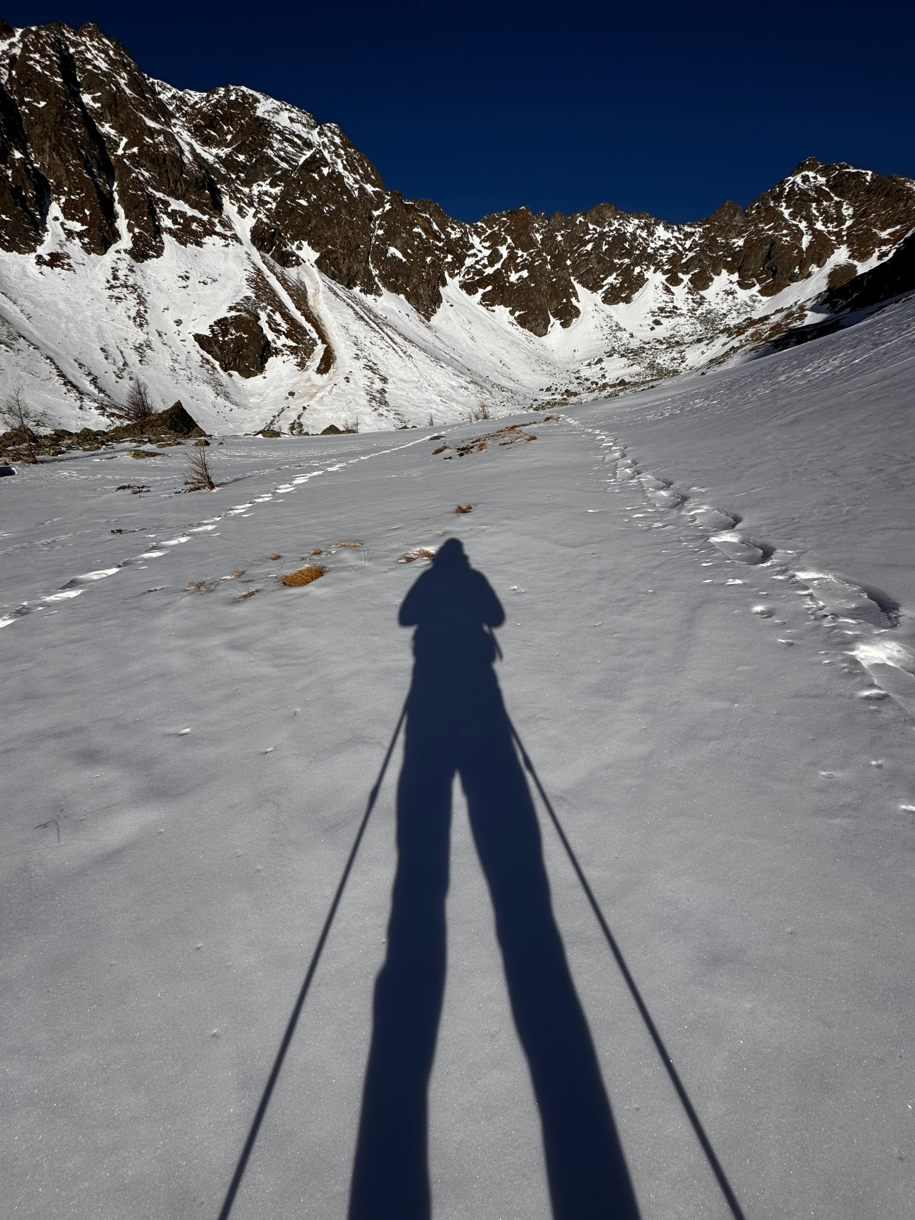 Mountain Winter Day with Skier Shadow · Free Stock Photo